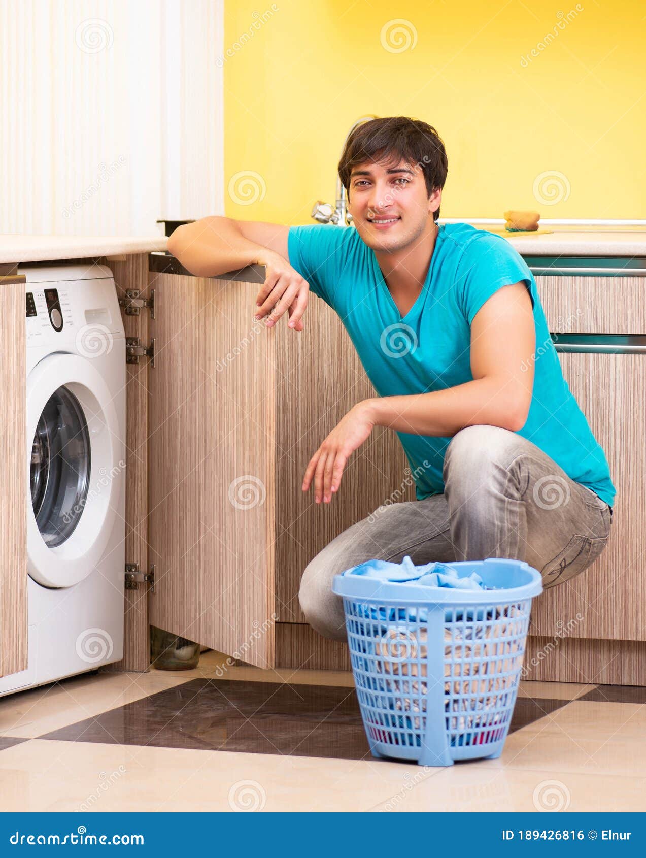 Young Husband Man Doing Laundry at Home Stock Photo - Image of indoors ...