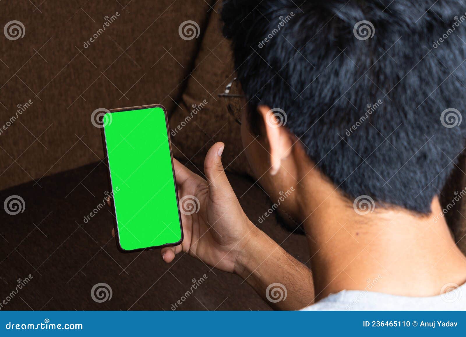 Young Indian Boy Holding a Mobile Phone with a Green Screen on it Stock ... Young Indian Boy Holding a Mobile Phone with a Green Screen on it Stock ...