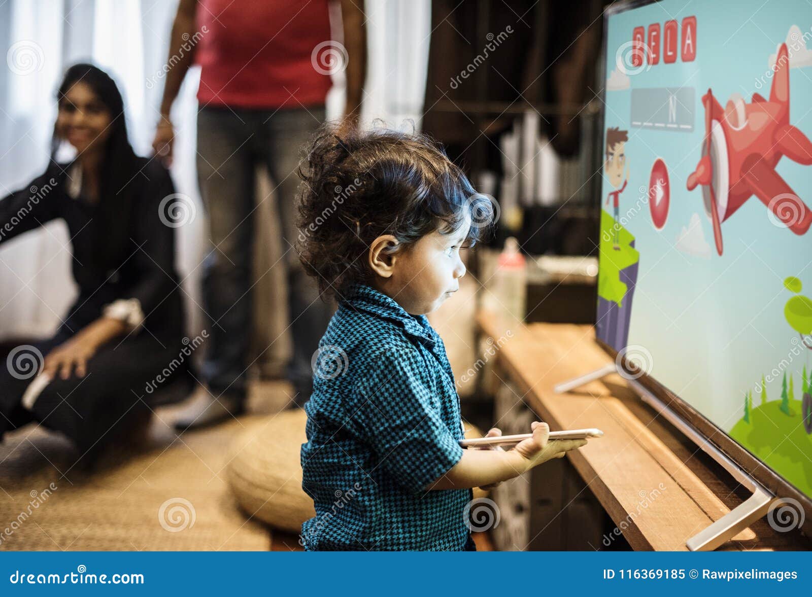 Young Television Addict Man Sitting On Home Sofa Watching TV And Eating ... Young Television Addict Man Sitting On Home Sofa Watching TV And Eating ...