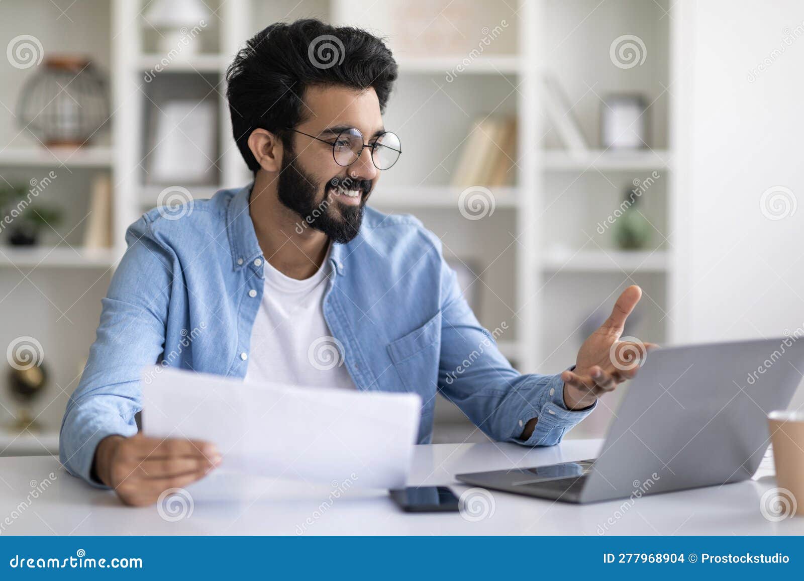 Young Indian Freelancer Man Making Video Call with Laptop at Home Stock ...