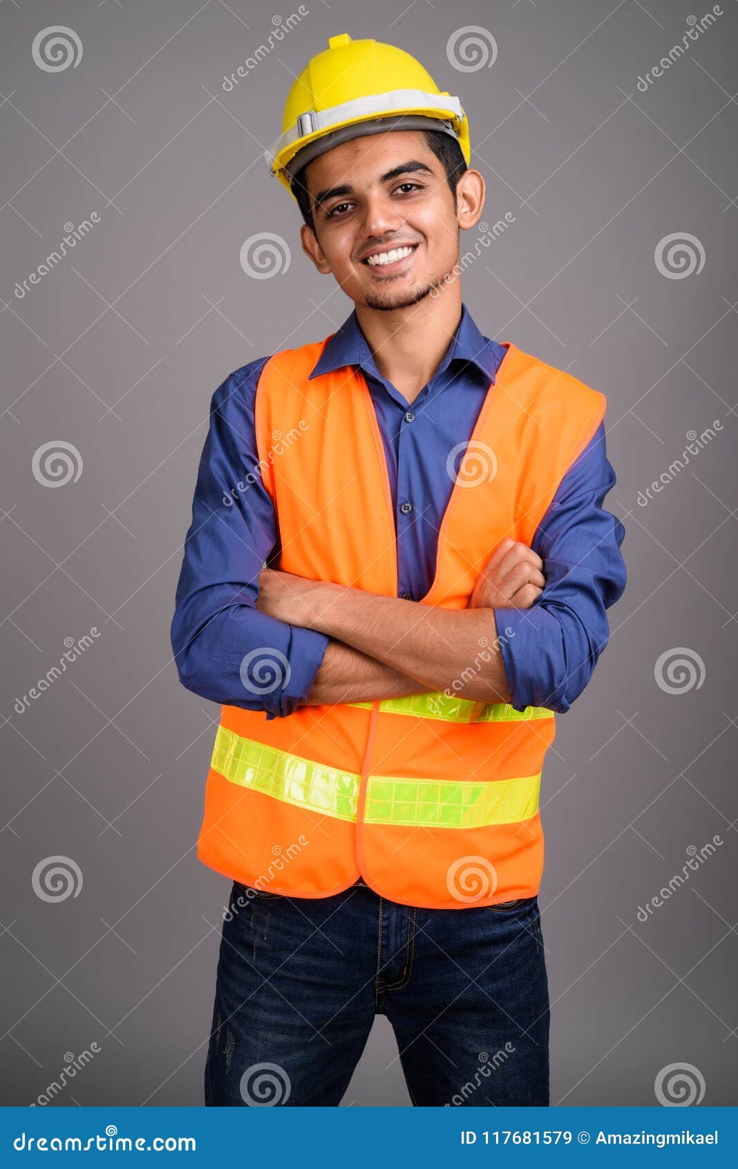 Young Indian Man Construction Worker Against Gray Background Stock ...