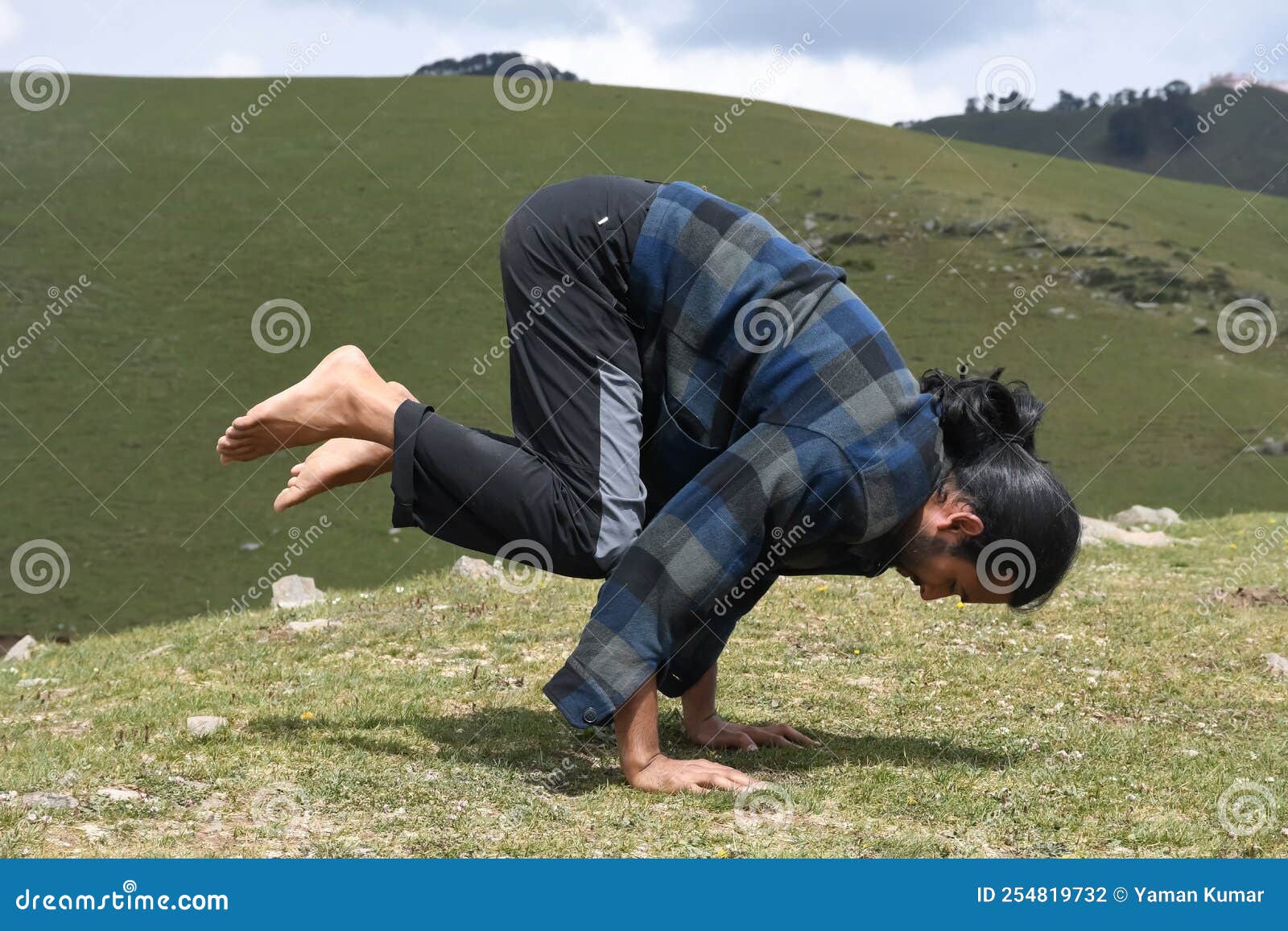 A Young Indian Man Doing Morning Exercise with Practicing Bakasana Yoga ...