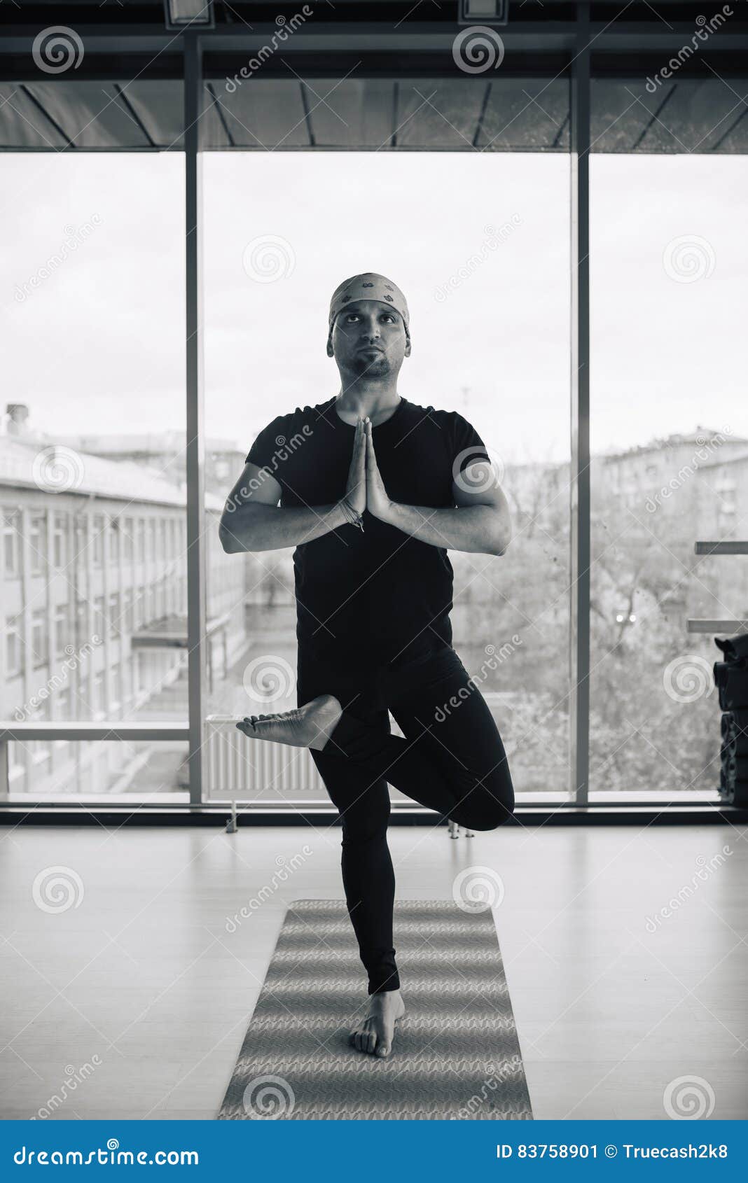 Young Indian Man Doing a Tree Pose during Yoga Practice Stock Image ...