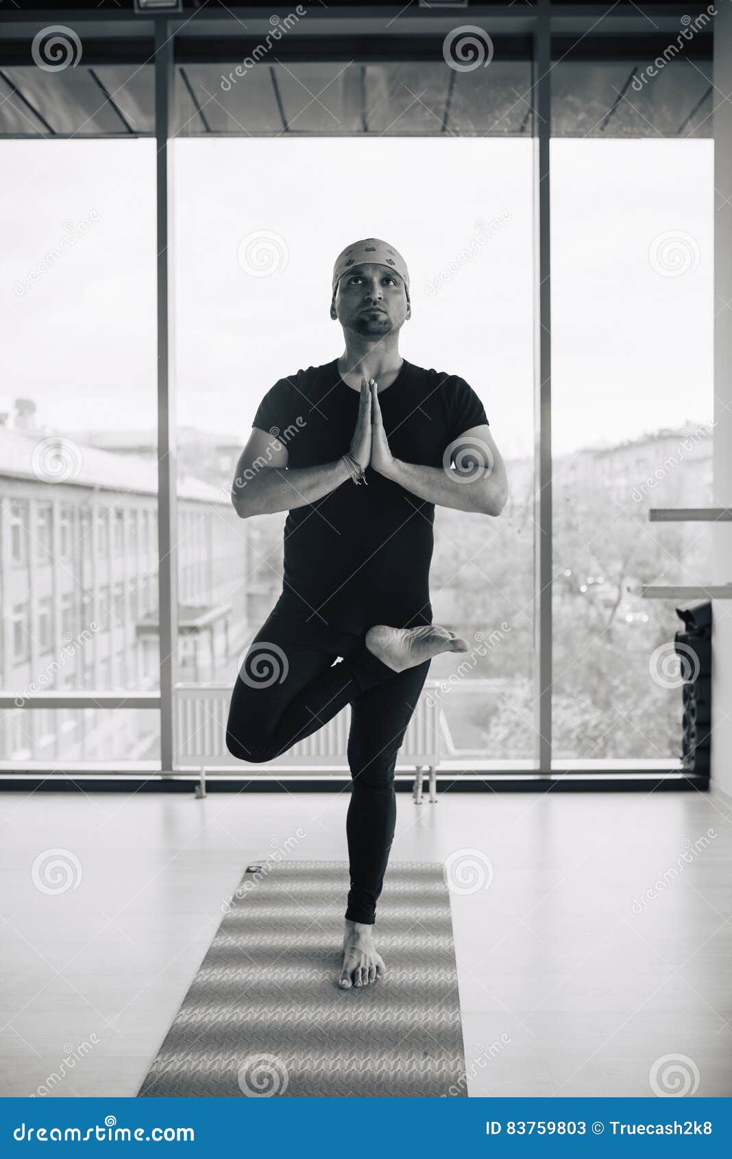 Young Indian Man Doing a Tree Pose during Yoga Practice Stock Image ...