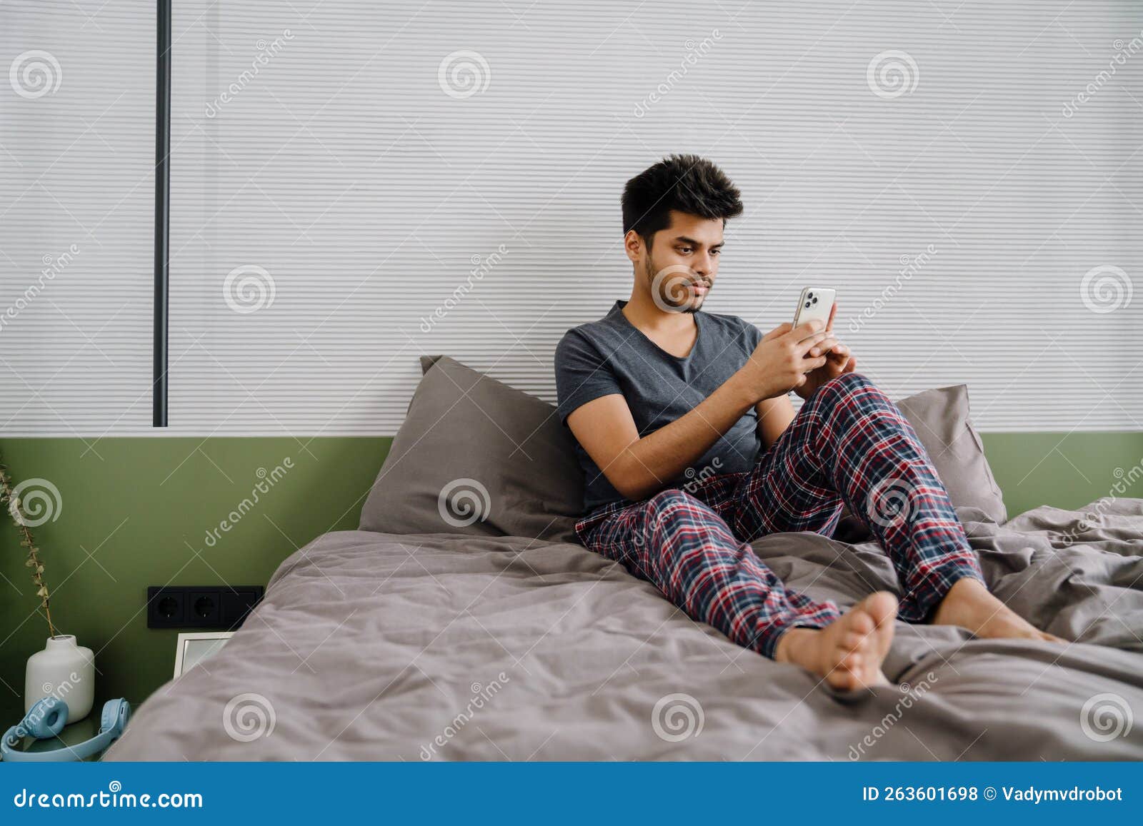 Young Indian Man Looking on His Phone Stock Photo - Image of watch ...