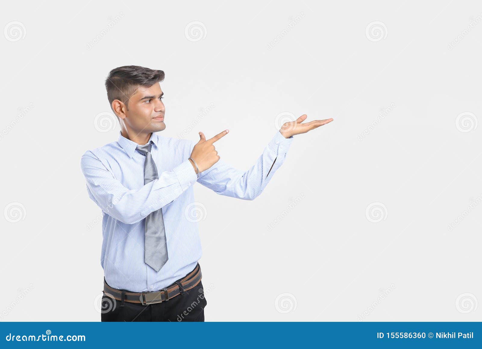 Young Indian Man Showing Direction with Hand Stock Photo - Image of ...
