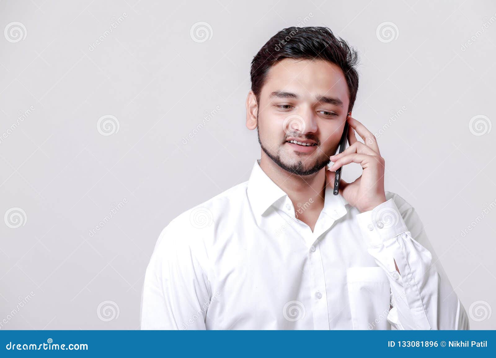 Young Indian Man Using Mobile Stock Photo - Image of building, portrait ...