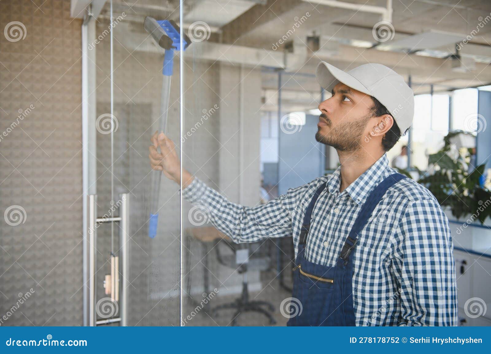 Young Indian Man Washing Window in Office. Stock Photo - Image of ...