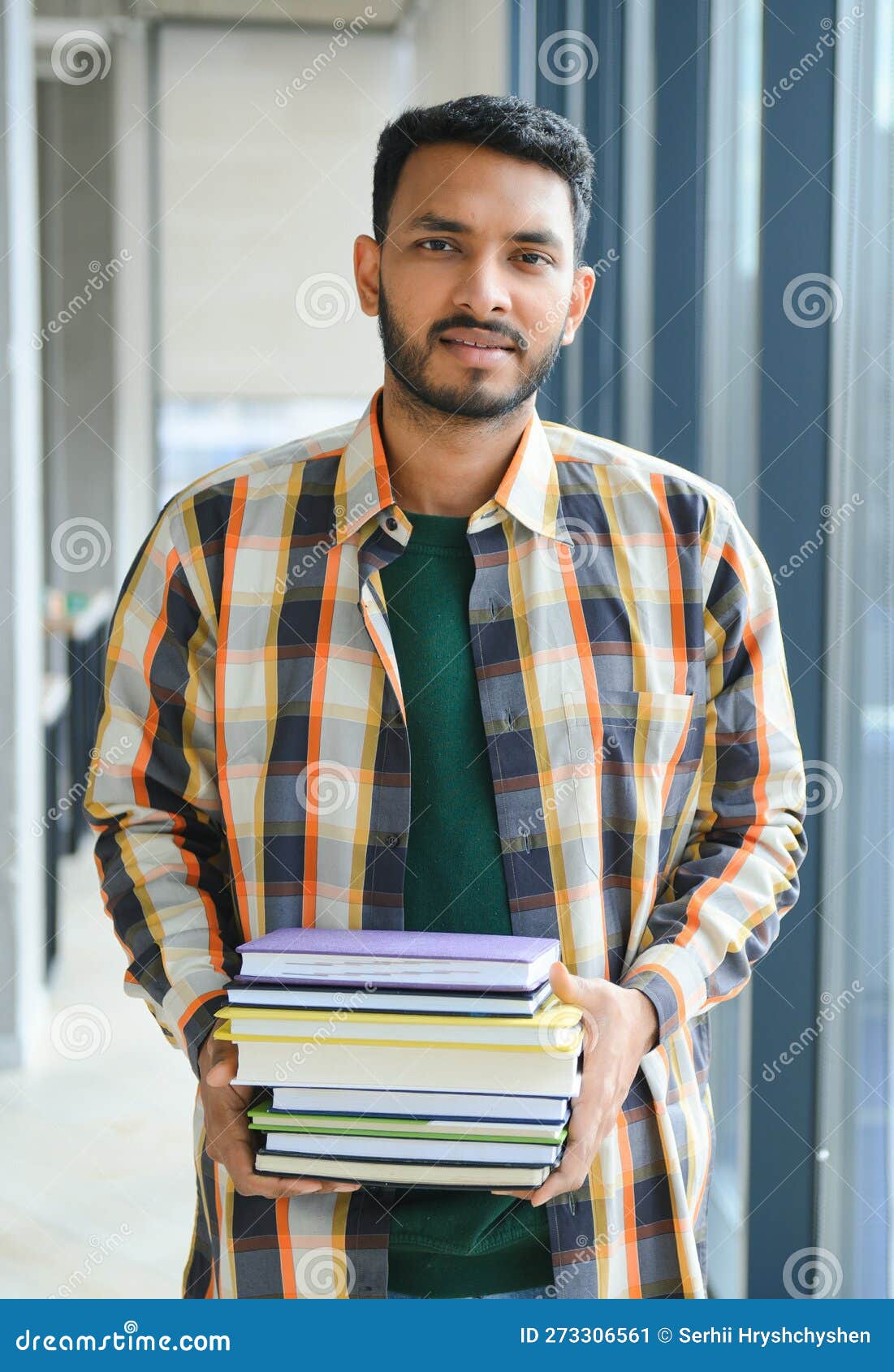 Young Indian Student Boy Reading Book Studying in College Library with ...