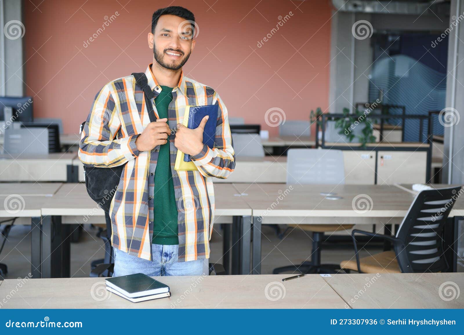 Young Indian Student Boy Reading Book Studying in College Library with ...