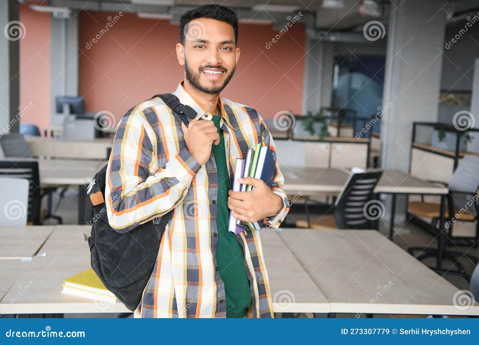 Young Indian Student Boy Reading Book Studying in College Library with ...