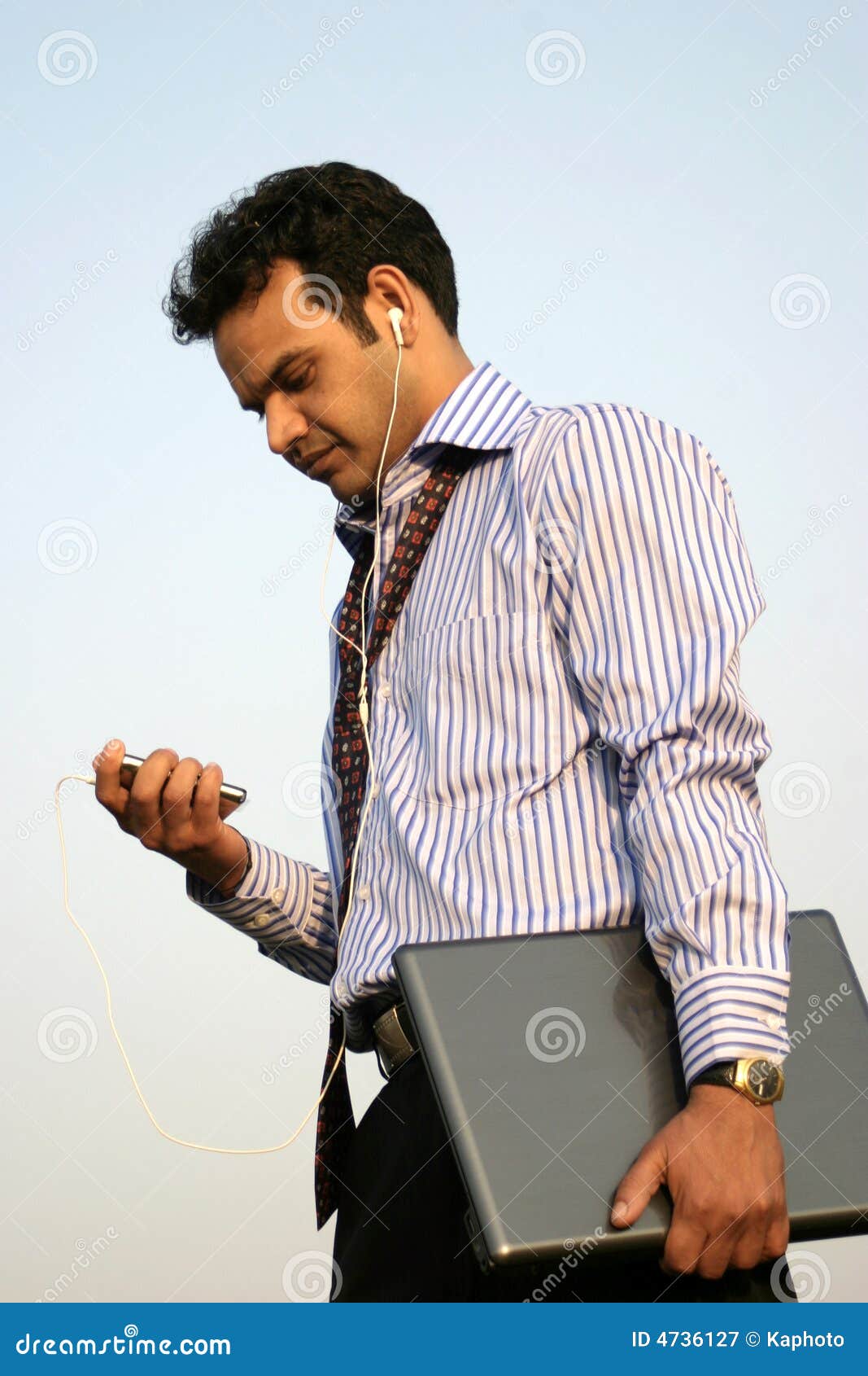 Young Indian Using Mp3 Player Stock Image - Image of india, asia: 4736127
