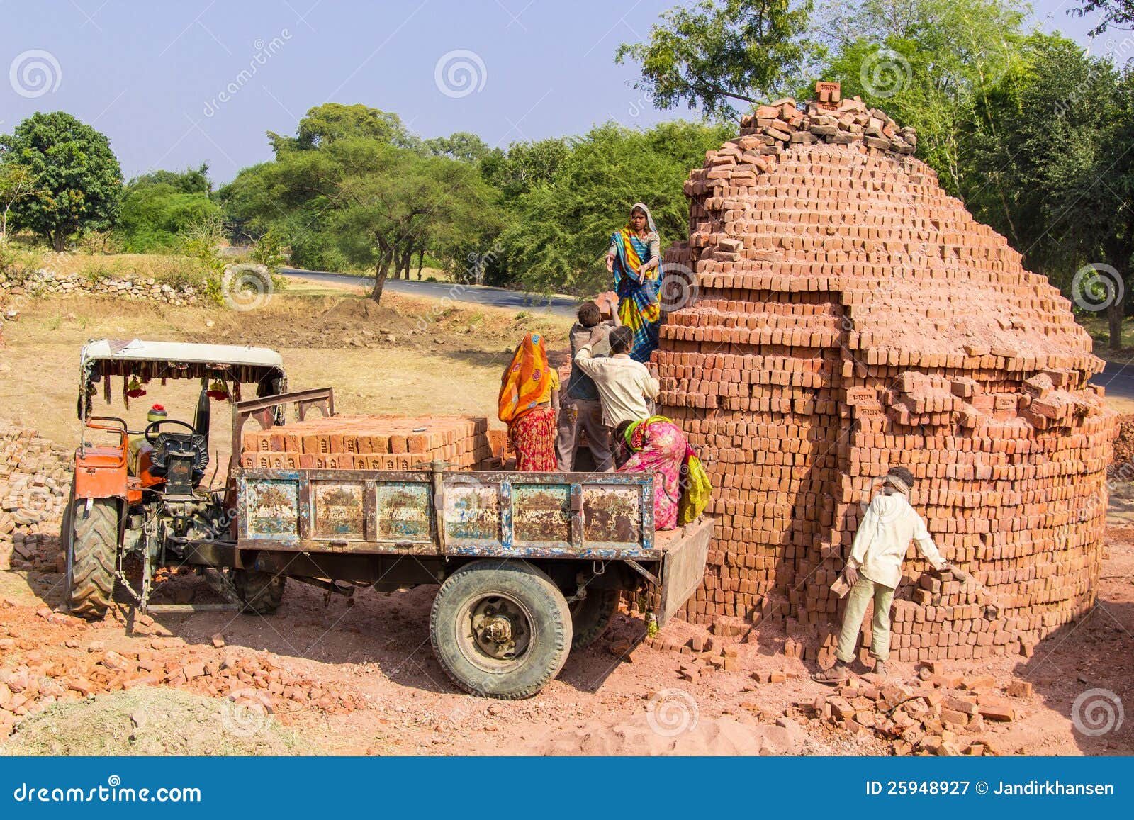 Young Indians Load Bricks on a Tractor. Editorial Photography - Image ...