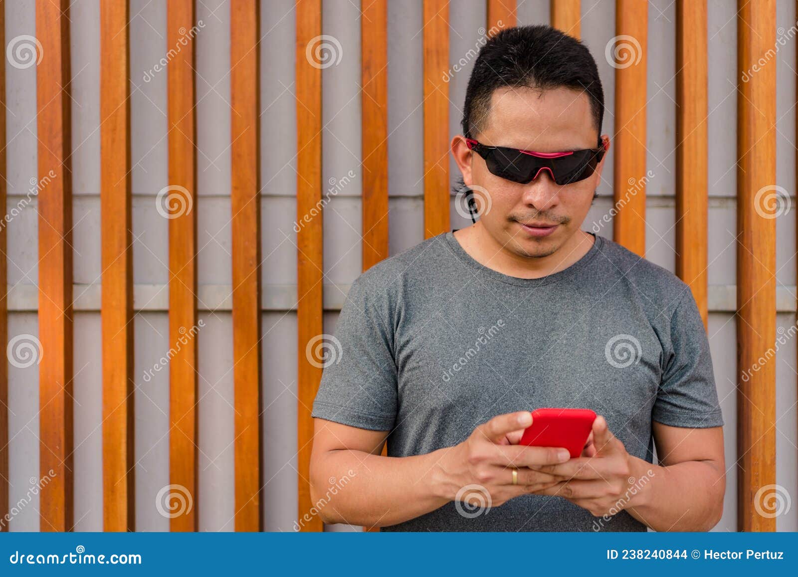 Young Indigenous Colombian Checking Mobile Phone Stock Photo - Image of ...