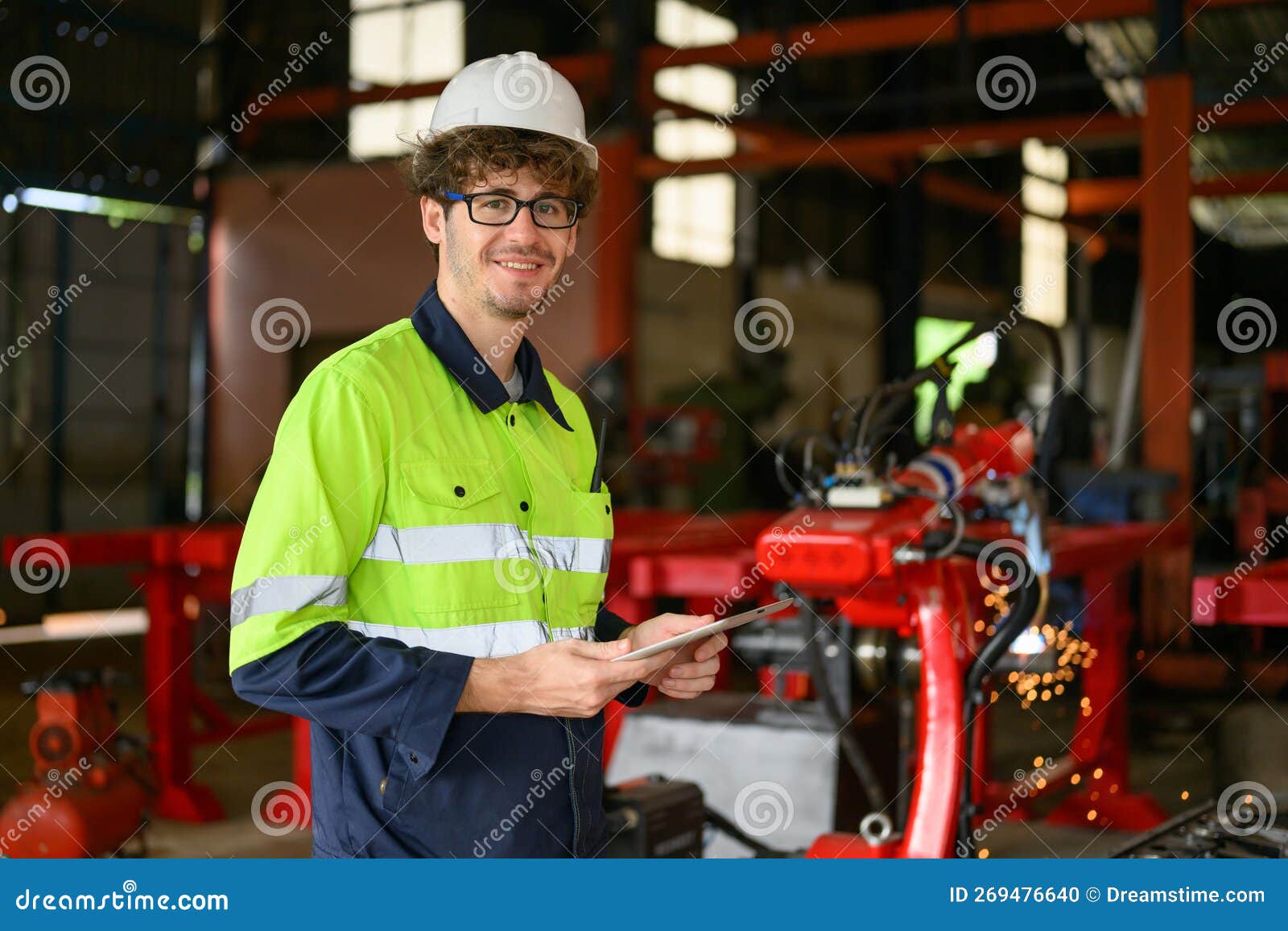 Young Industrial Engineer Holding Tablet Checking and Controlling ...