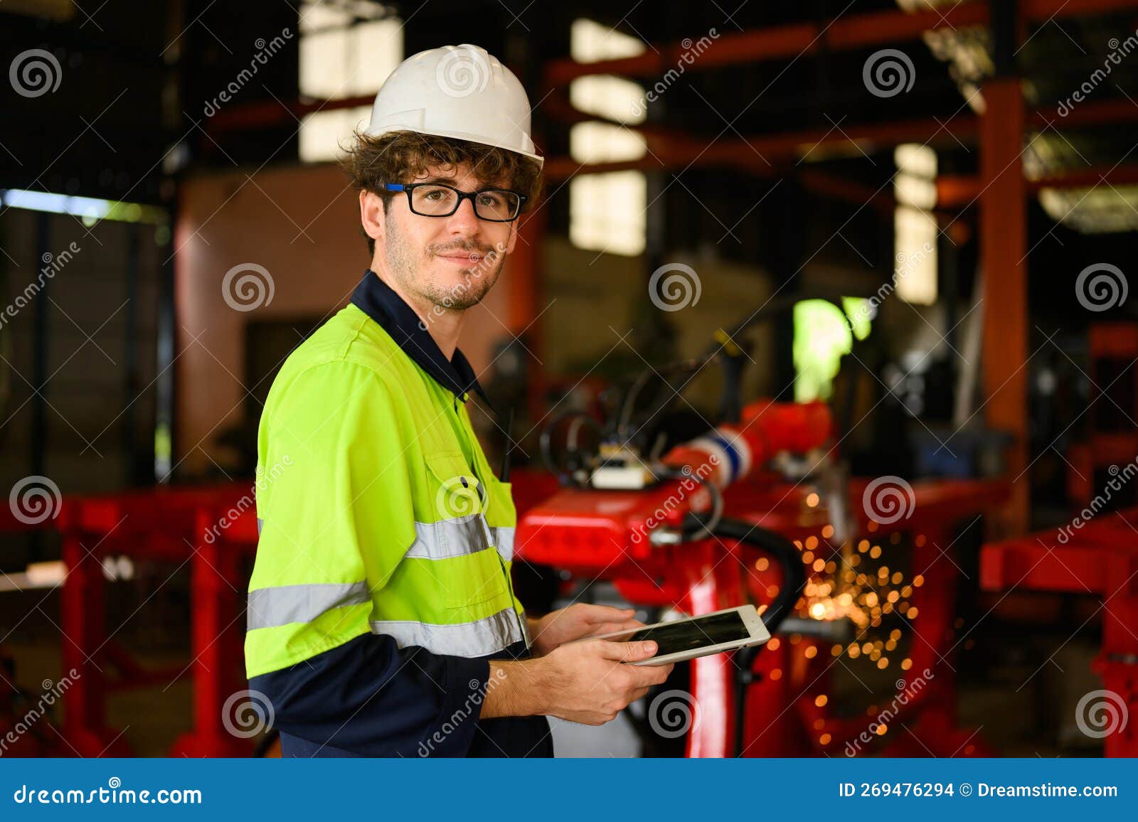 Young Industrial Engineer Holding Tablet Checking and Controlling ...
