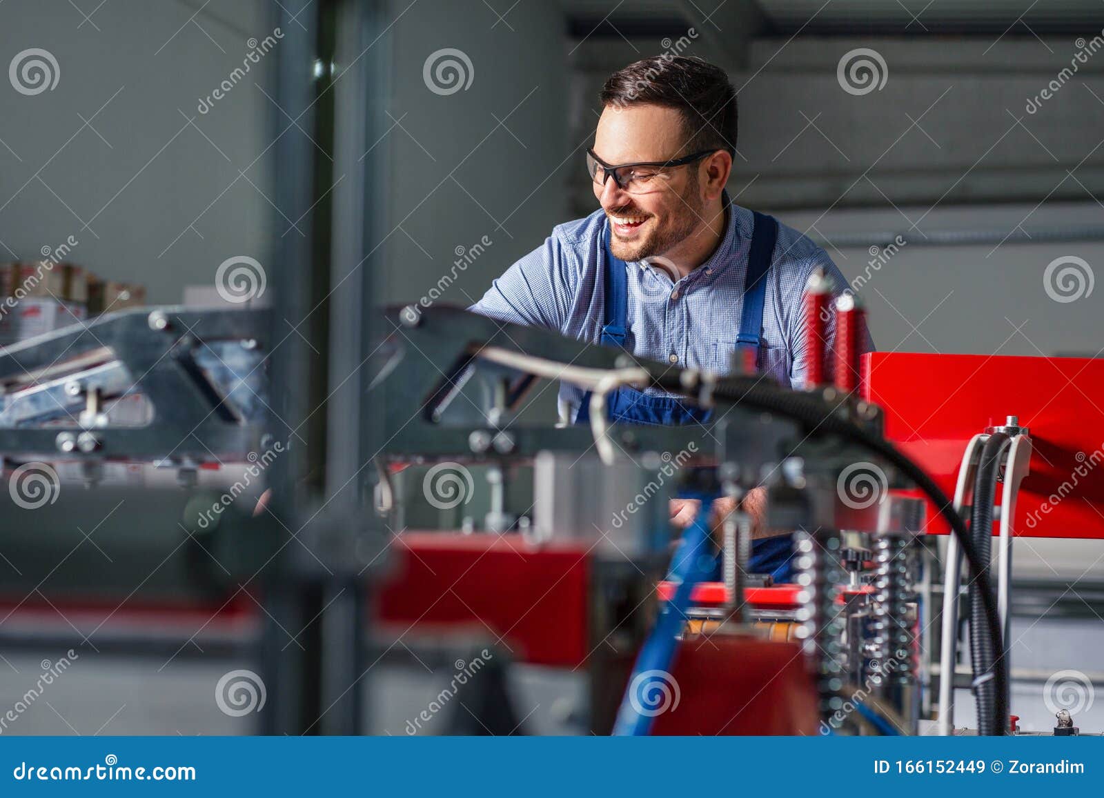 Industrial Machine Operator Working in Factory. Stock Image - Image of ...