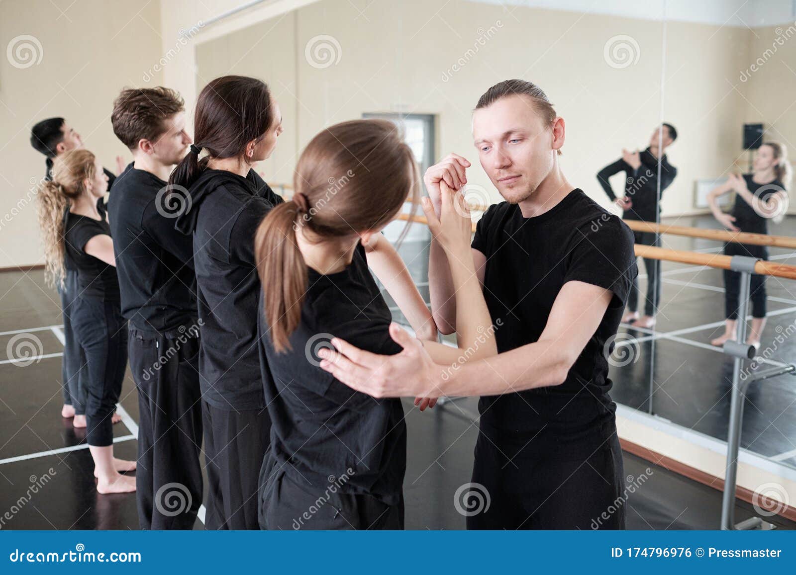 Young Instructor of Modern Ballet Dancing Cource Helping One of His ...
