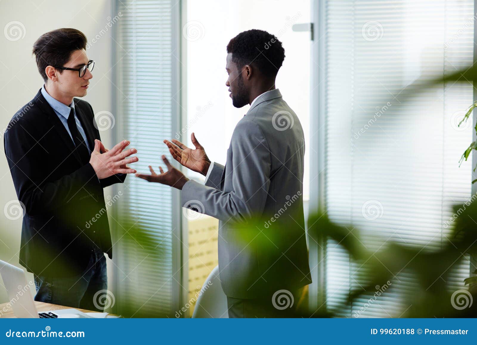 Conversation of colleagues stock photo. Image of conversation - 99620188