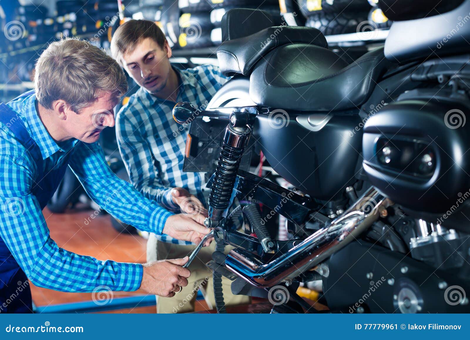 Young Interested Man Customer Asking Technician about Motorcycle Stock ...