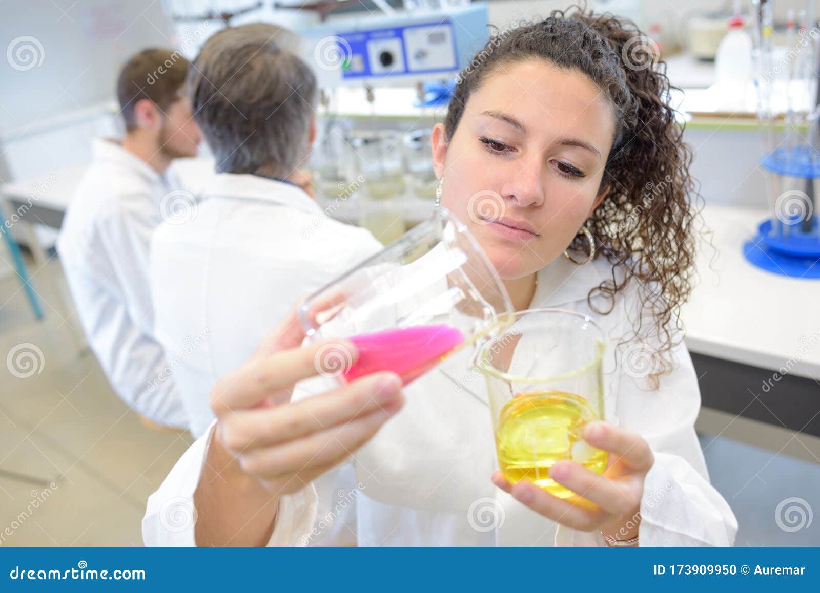 Young Intern Chemist Mixing Chemicals Stock Photo - Image of studying ...