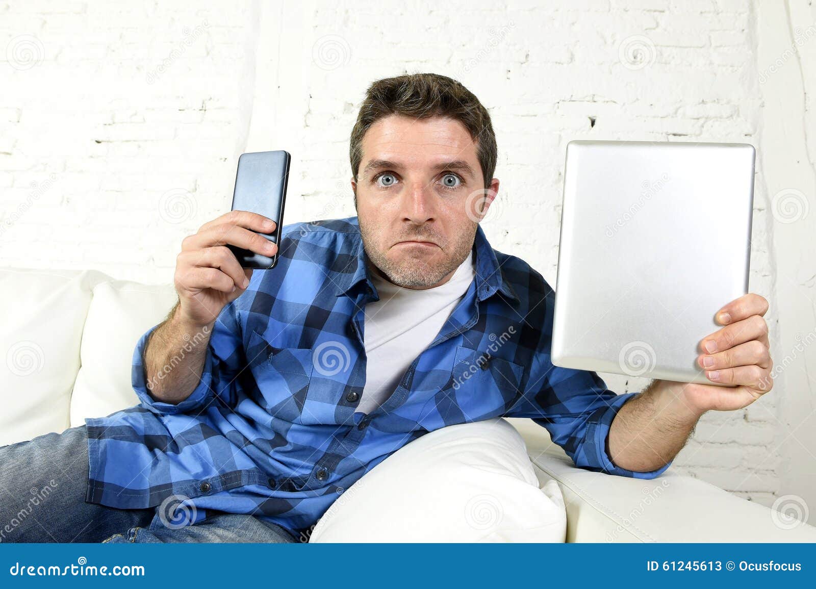 Young Internet and Technology Addict Man Networking with Mobile Phone ...