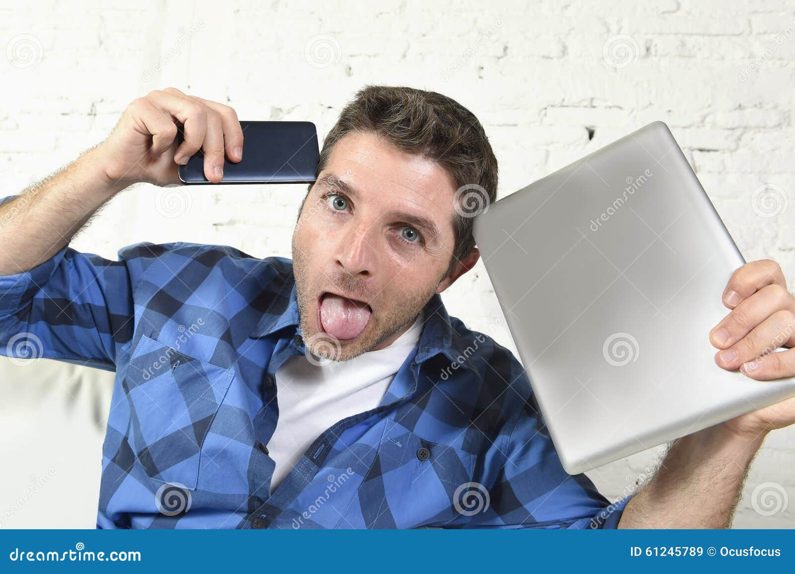 Young Internet and Technology Addict Man Networking with Mobile Phone ...