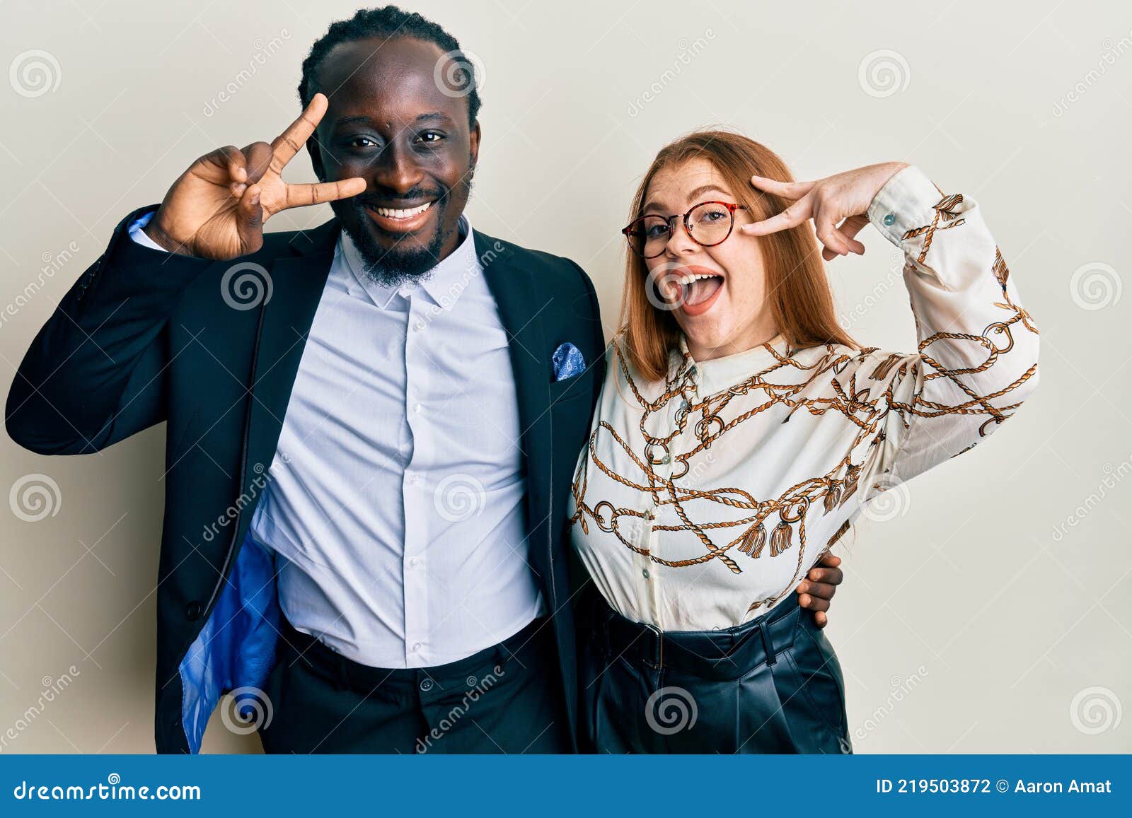 Young Interracial Couple Wearing Business And Elegant Clothes Doing