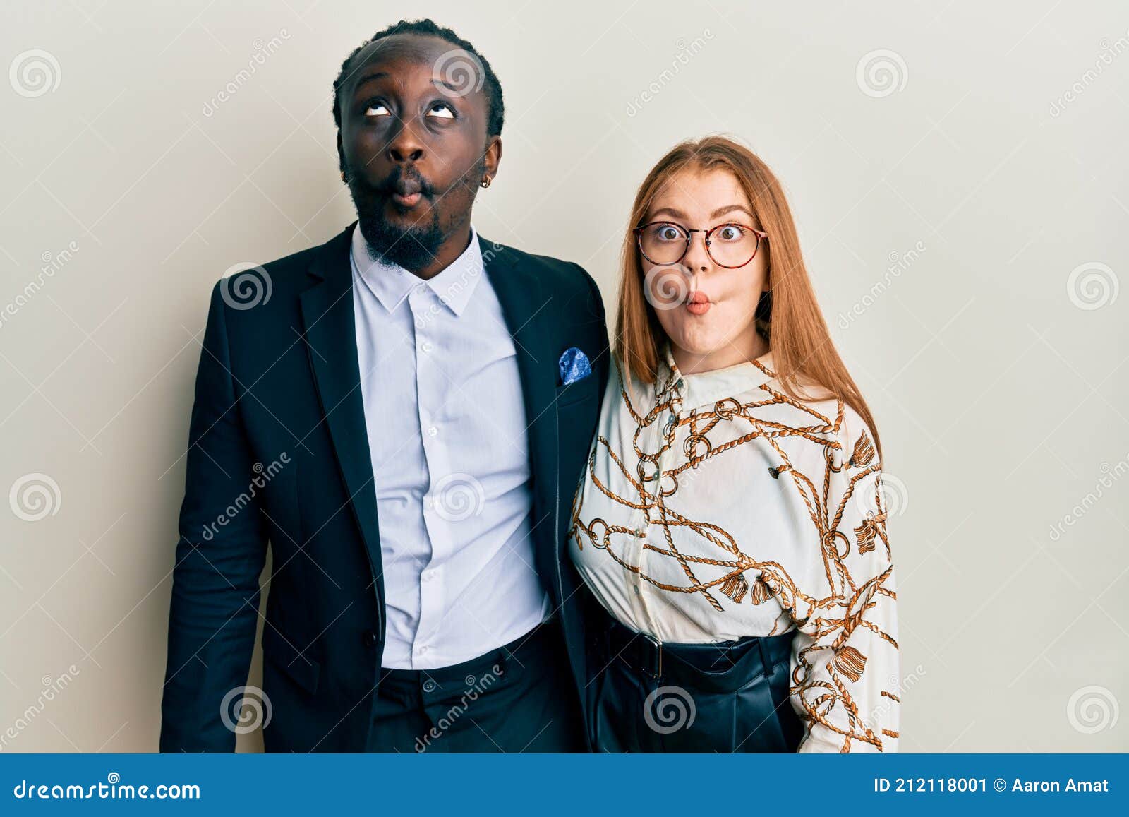 Young Interracial Couple Wearing Business And Elegant Clothes Making