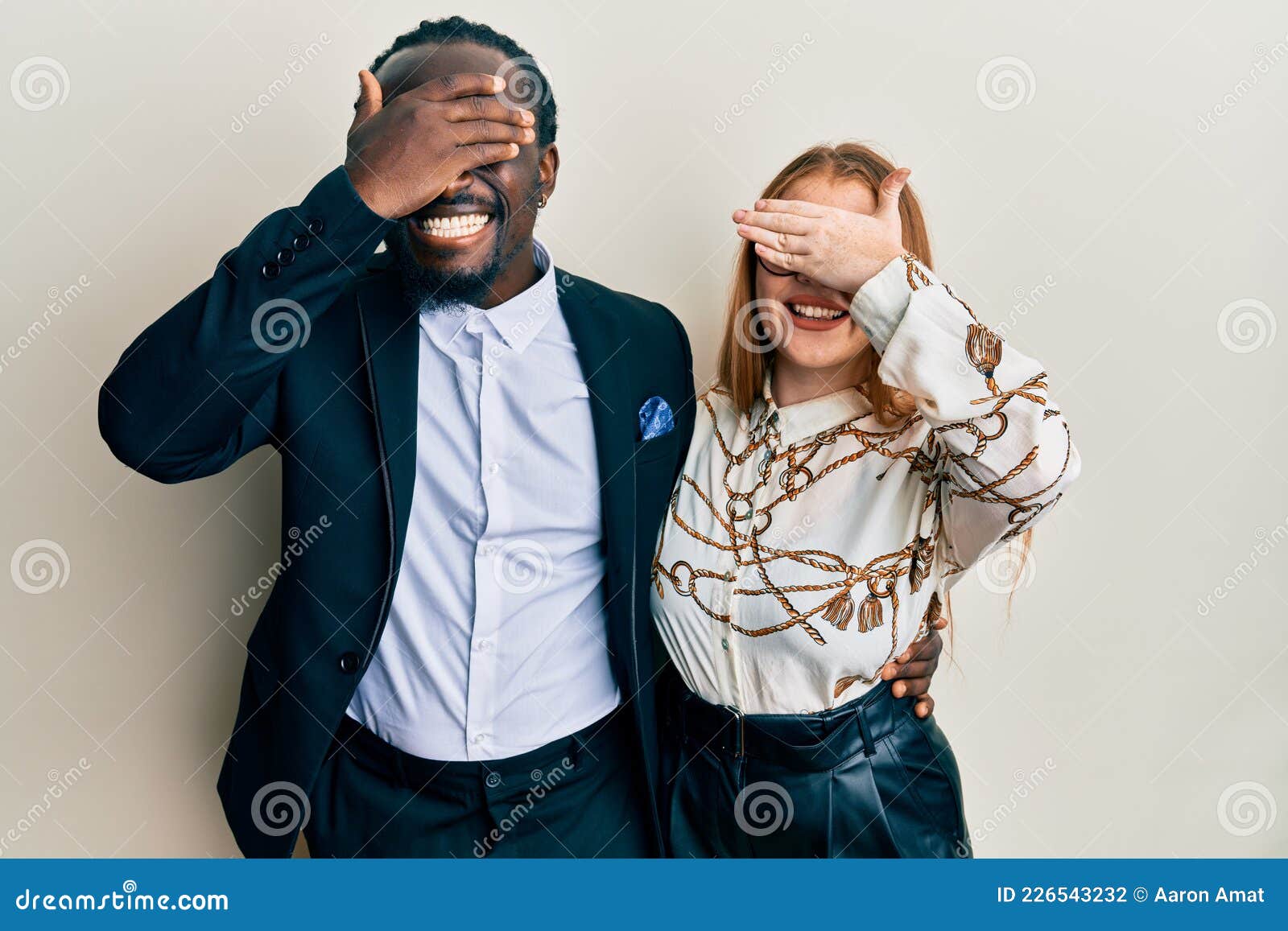Young Interracial Couple Wearing Business And Elegant Clothes Smiling