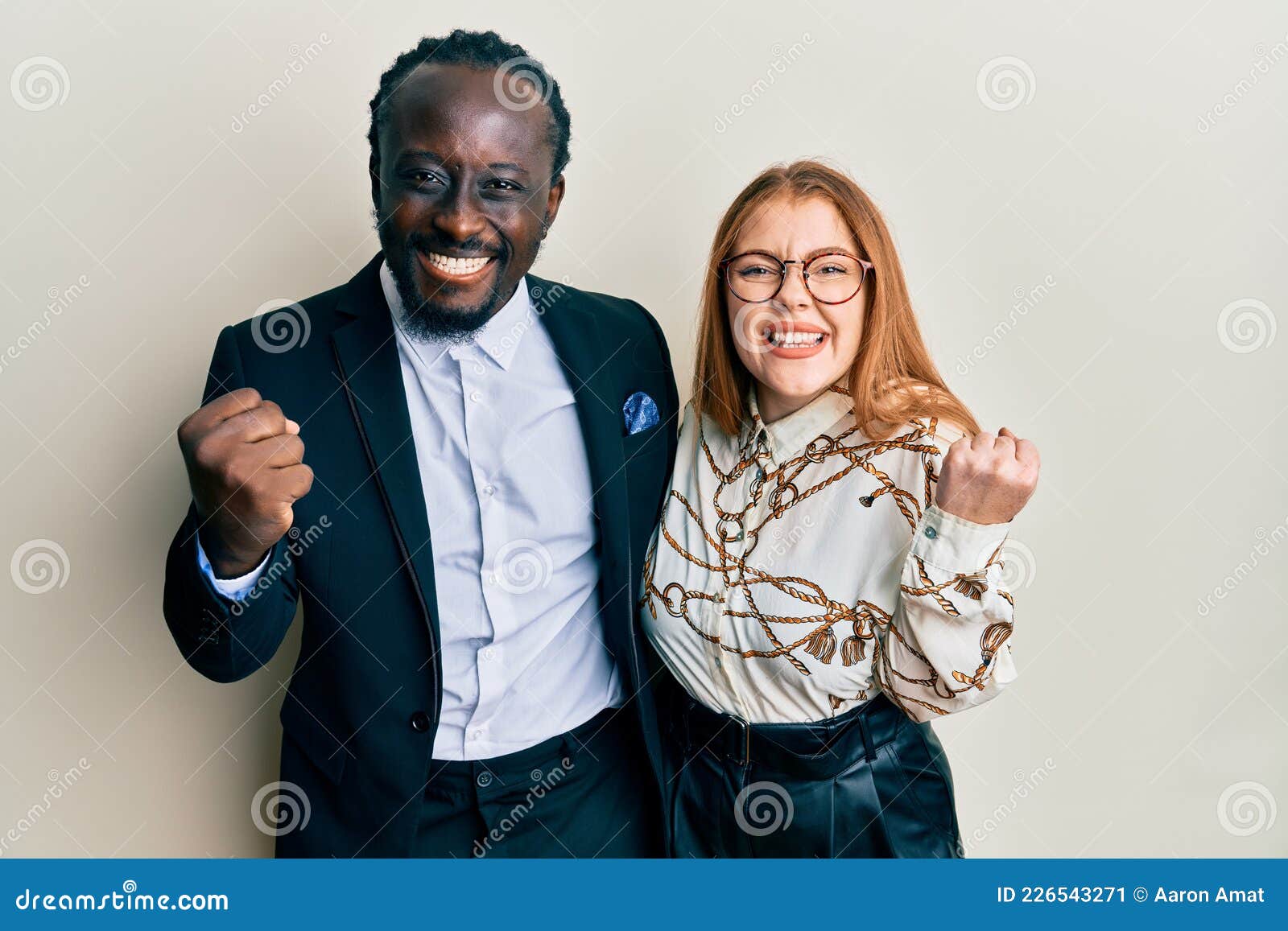 Young Interracial Couple Wearing Business And Elegant Clothes Very