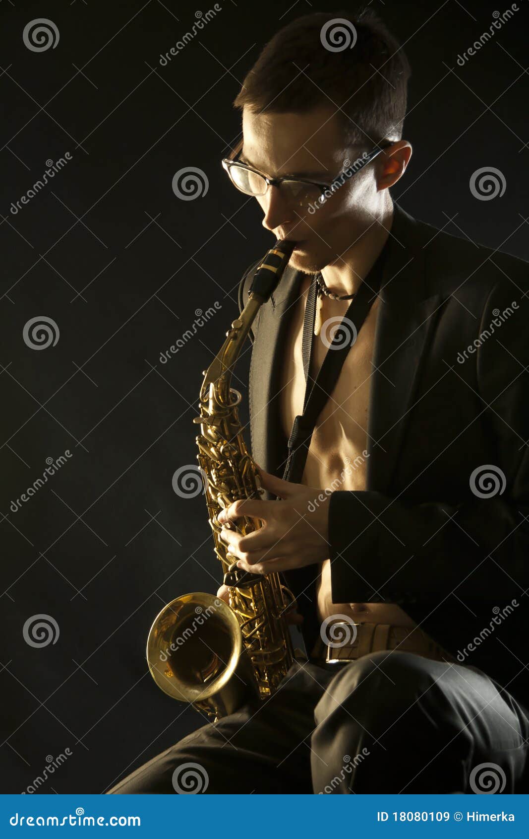 Young Jazzman Plaing a Saxophone on Black Stock Image - Image of ...