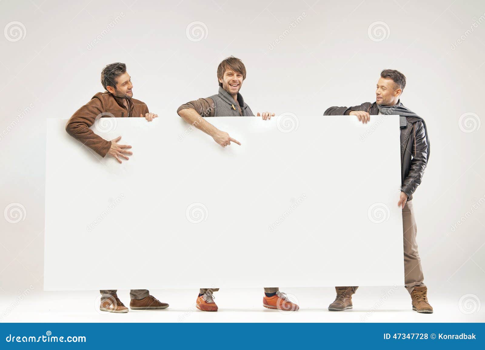 Young Joyful Guys Holding White Board Stock Photo - Image of group ...