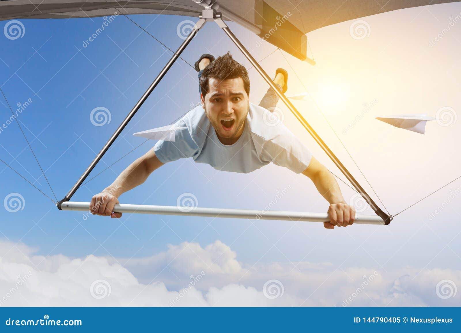 Young Man Flying on Hang Glider. Mixed Media Stock Image - Image of ...