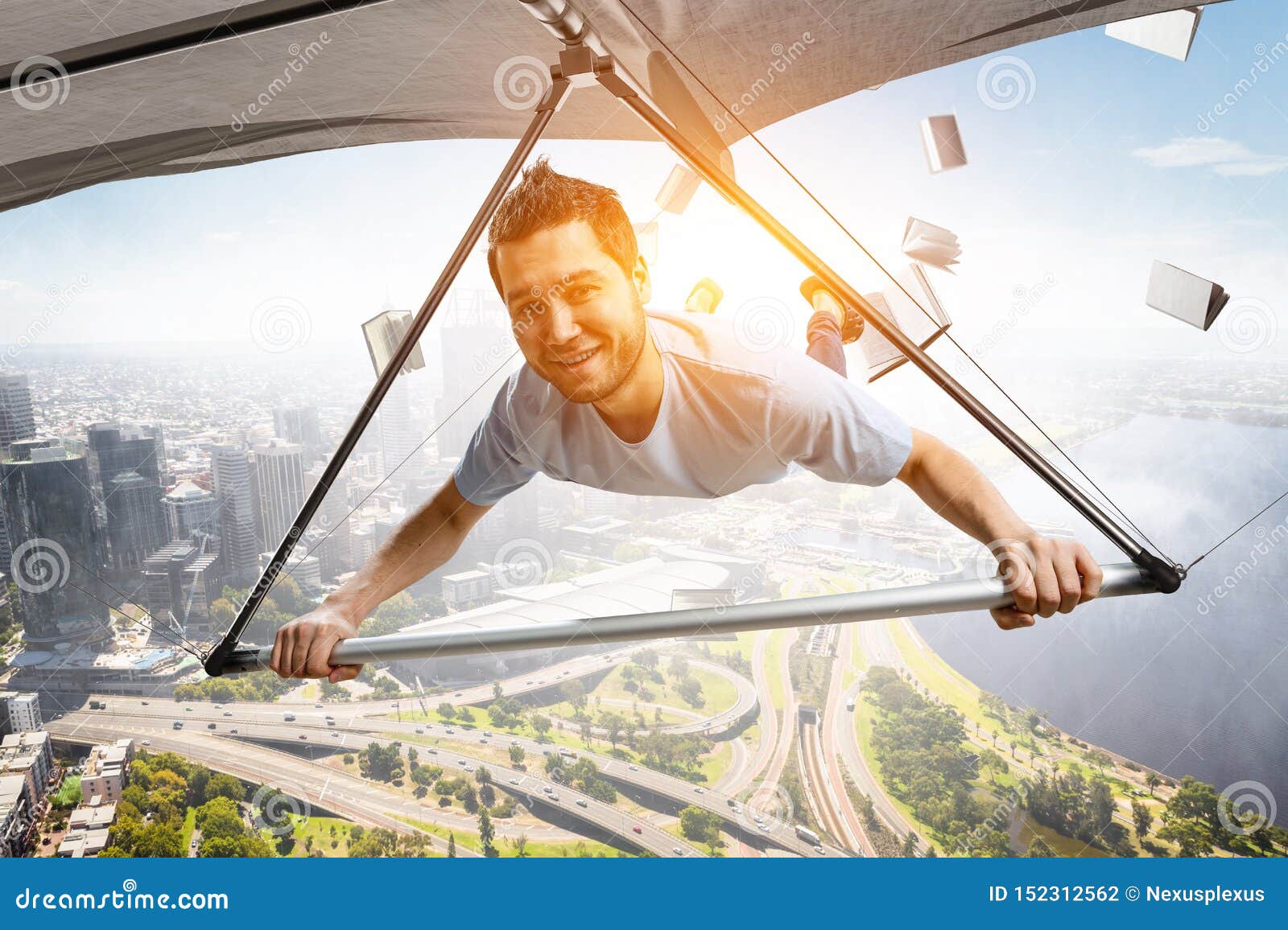 Young Man Flying on Hang Glider. Mixed Media Stock Photo - Image of ...