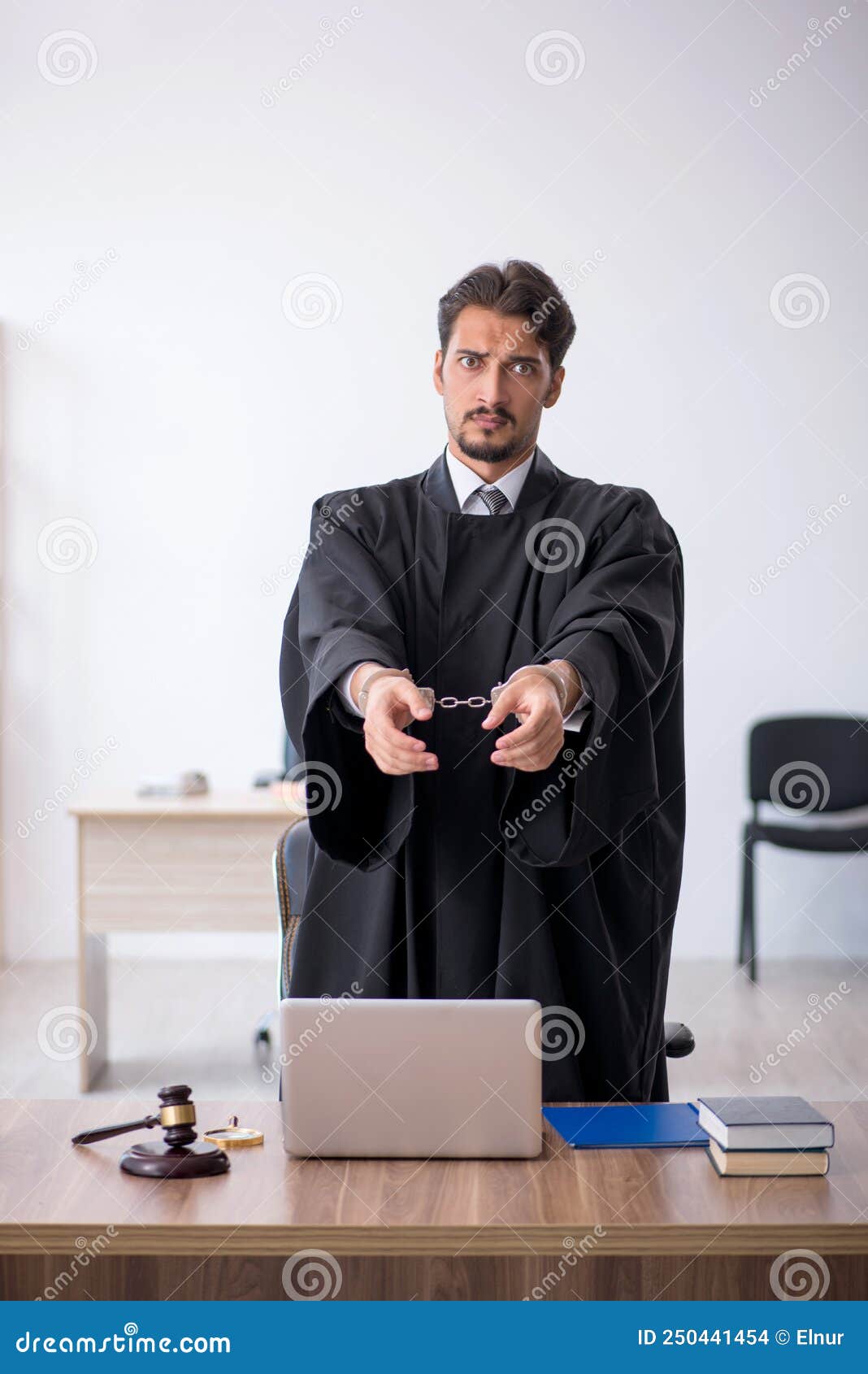 Young Male Judge in Corruption Concept Stock Photo - Image of ...