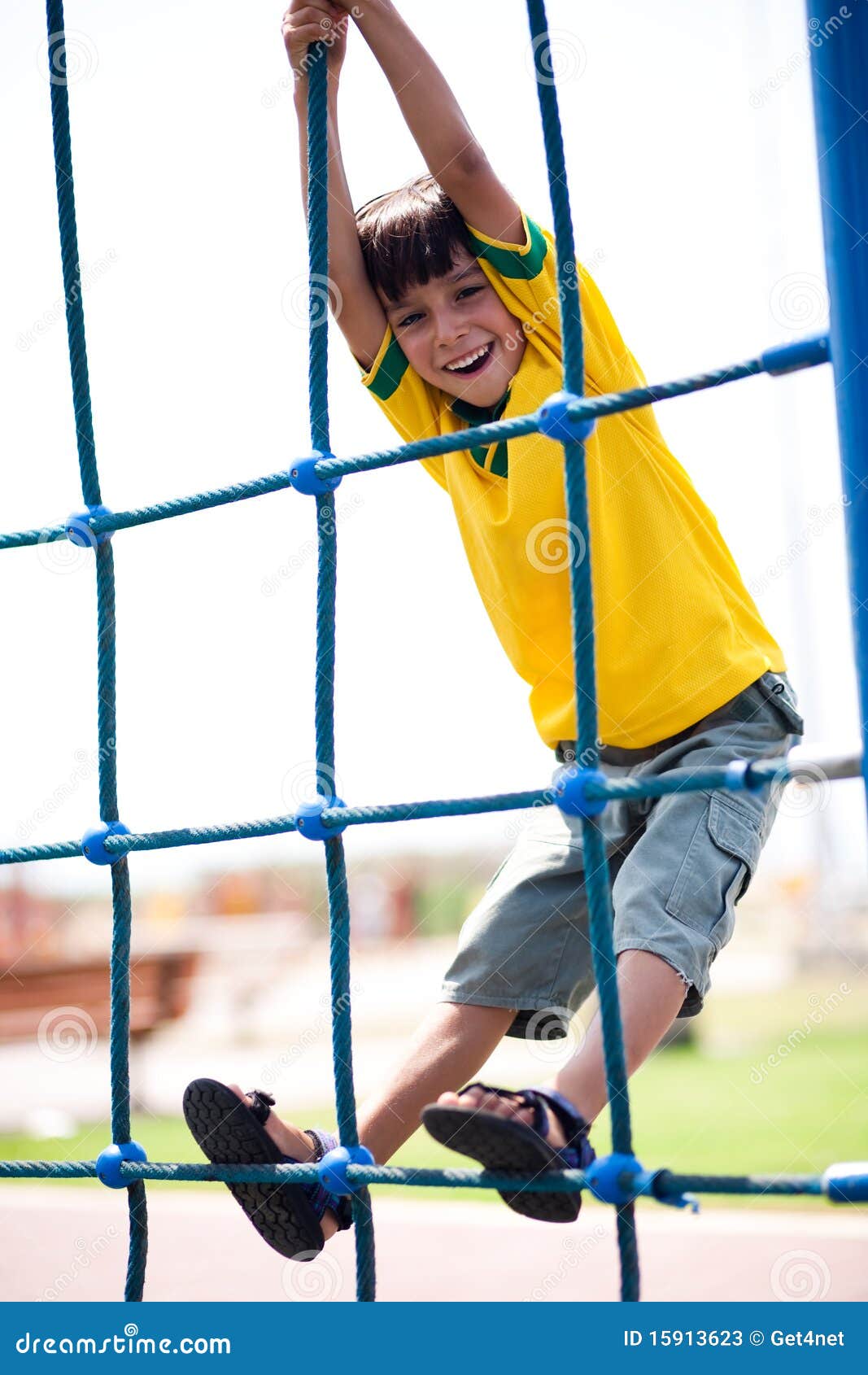 Young kid on playstructure stock image. Image of play - 15913623