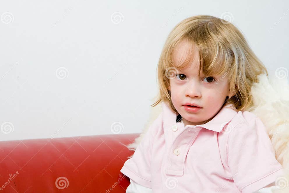 Young Kid Sitting Down Posing and Smiling Stock Photo - Image of clever ...