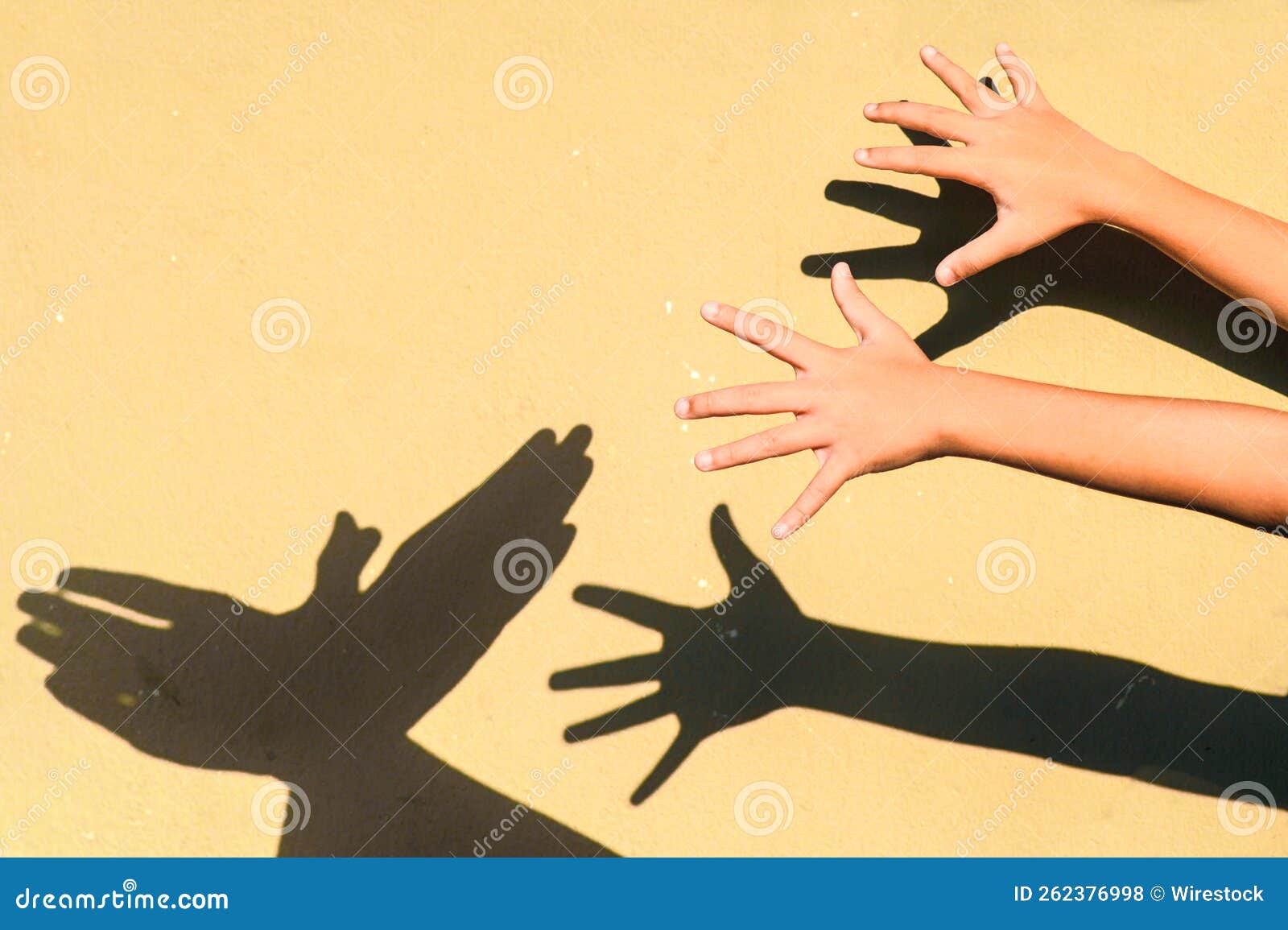 Kids Making Different Shadow Symbols with Hands on the Wall Stock Photo ...