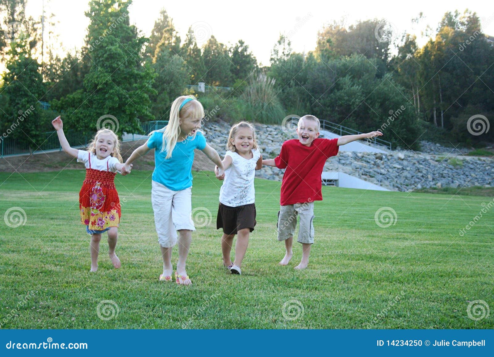 Young kids running outside stock photo. Image of dandelions - 14234250