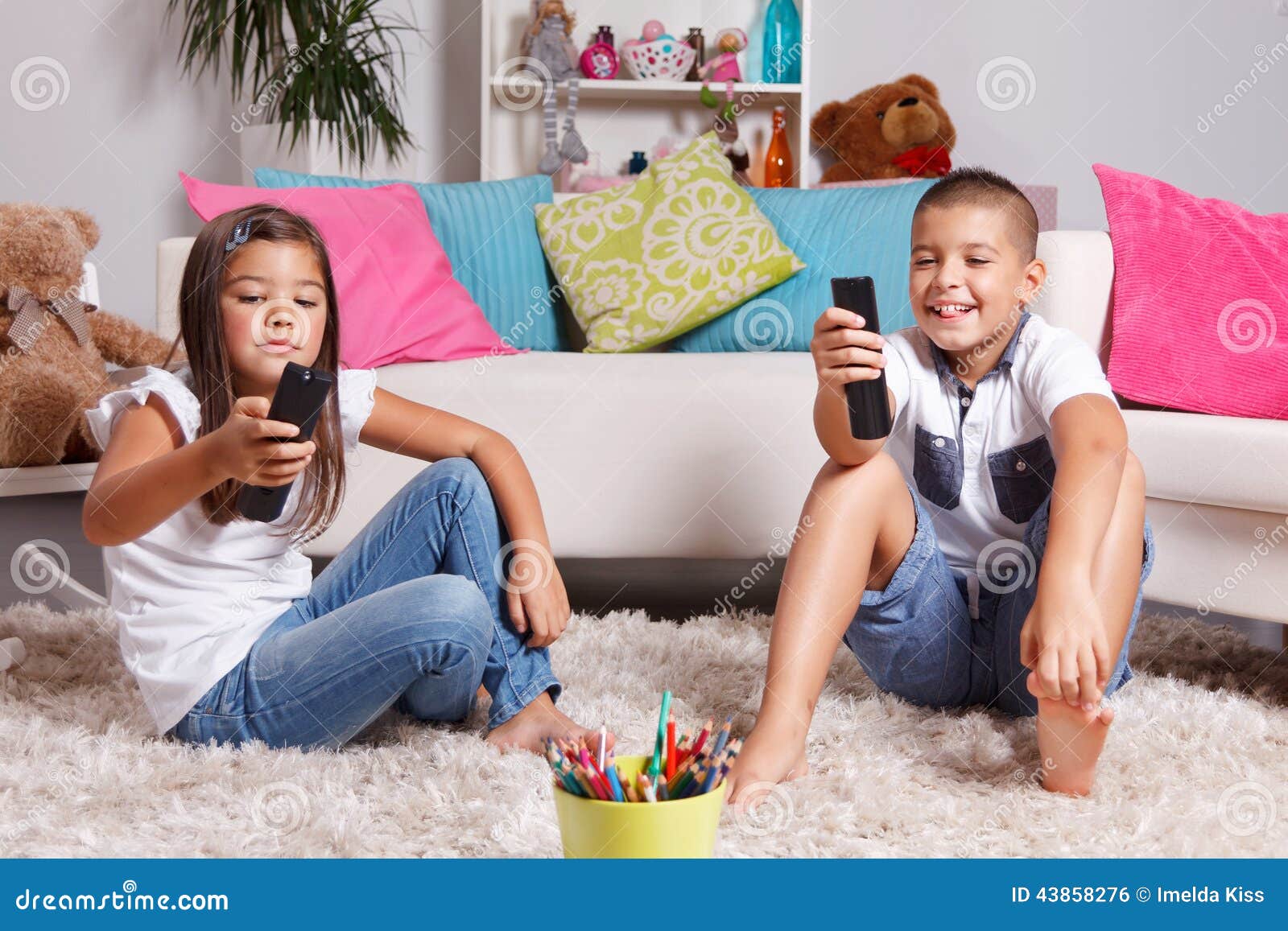 Young kids watching TV stock photo. Image of childhood - 43858276