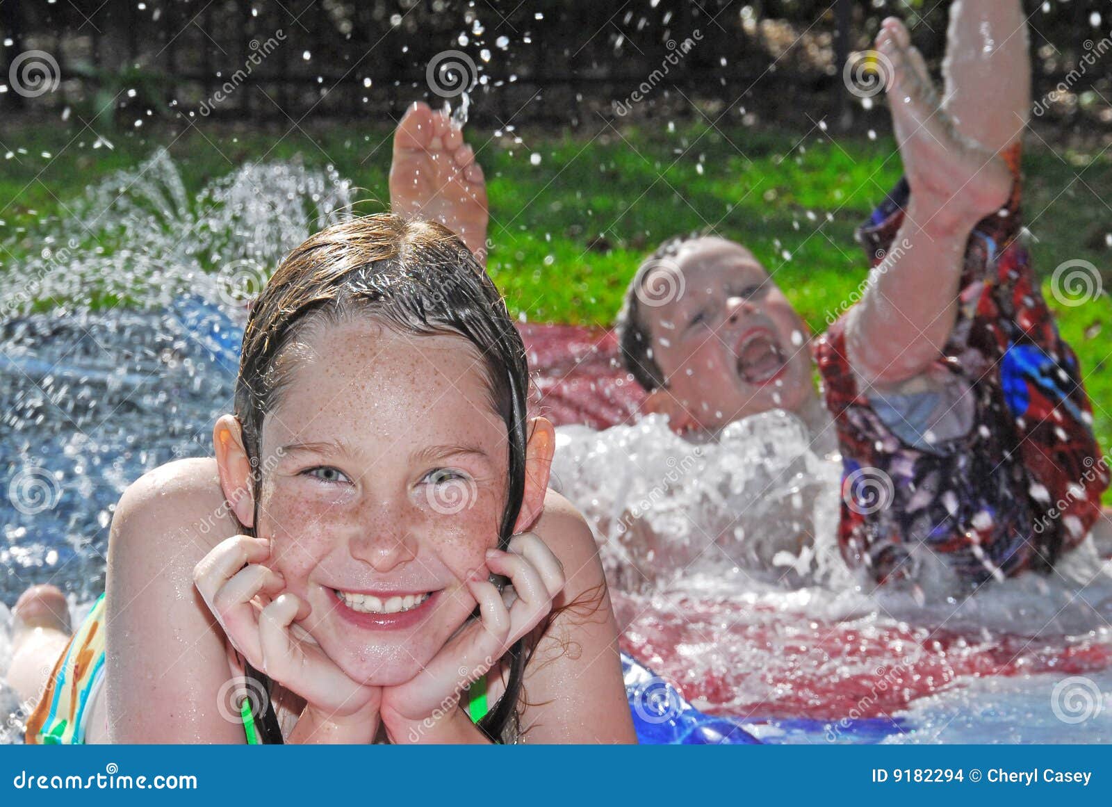 Young kids in water play stock photo. Image of bathing - 9182294