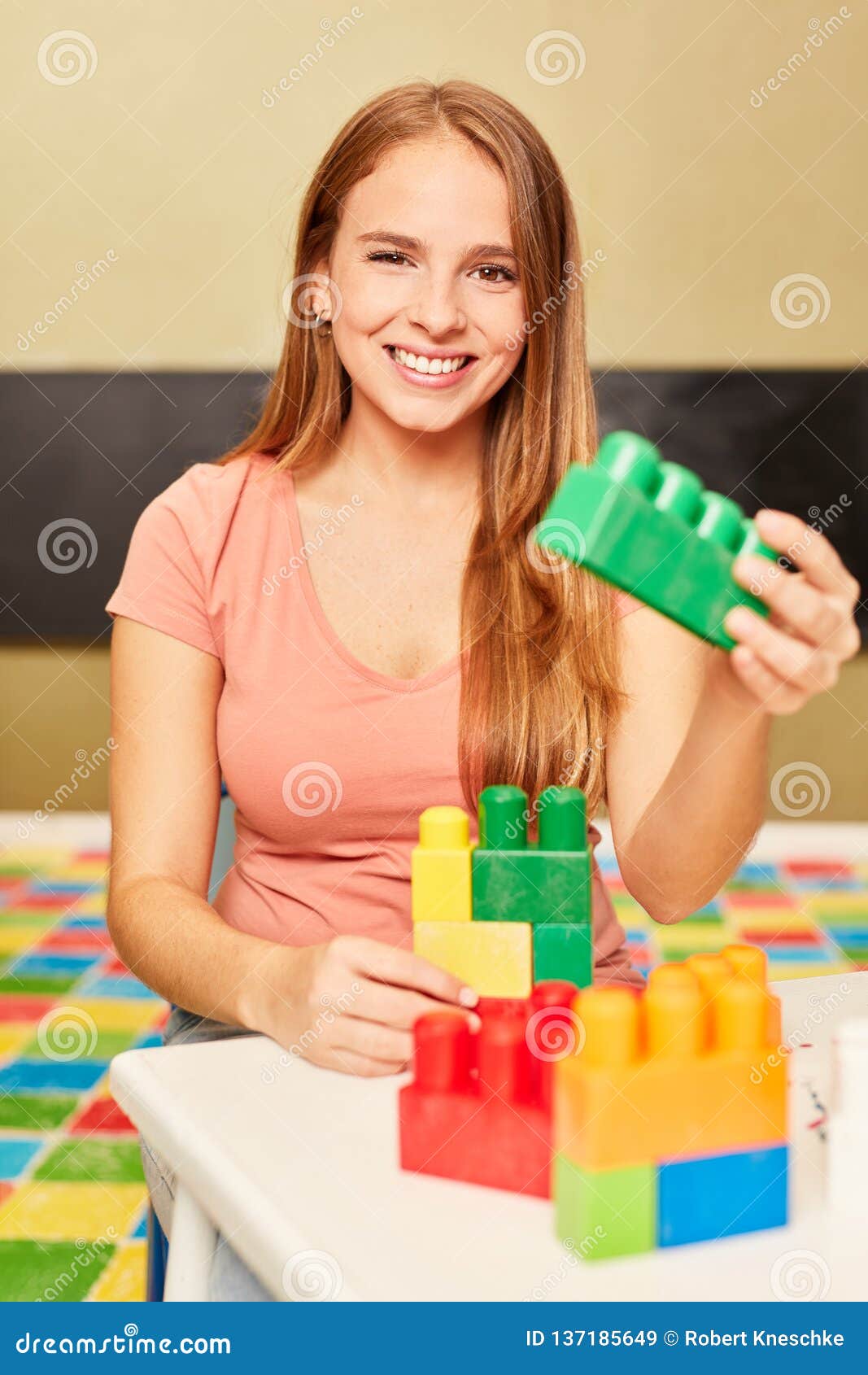 Young Kindergarten Teacher with Building Blocks Stock Image - Image of ...