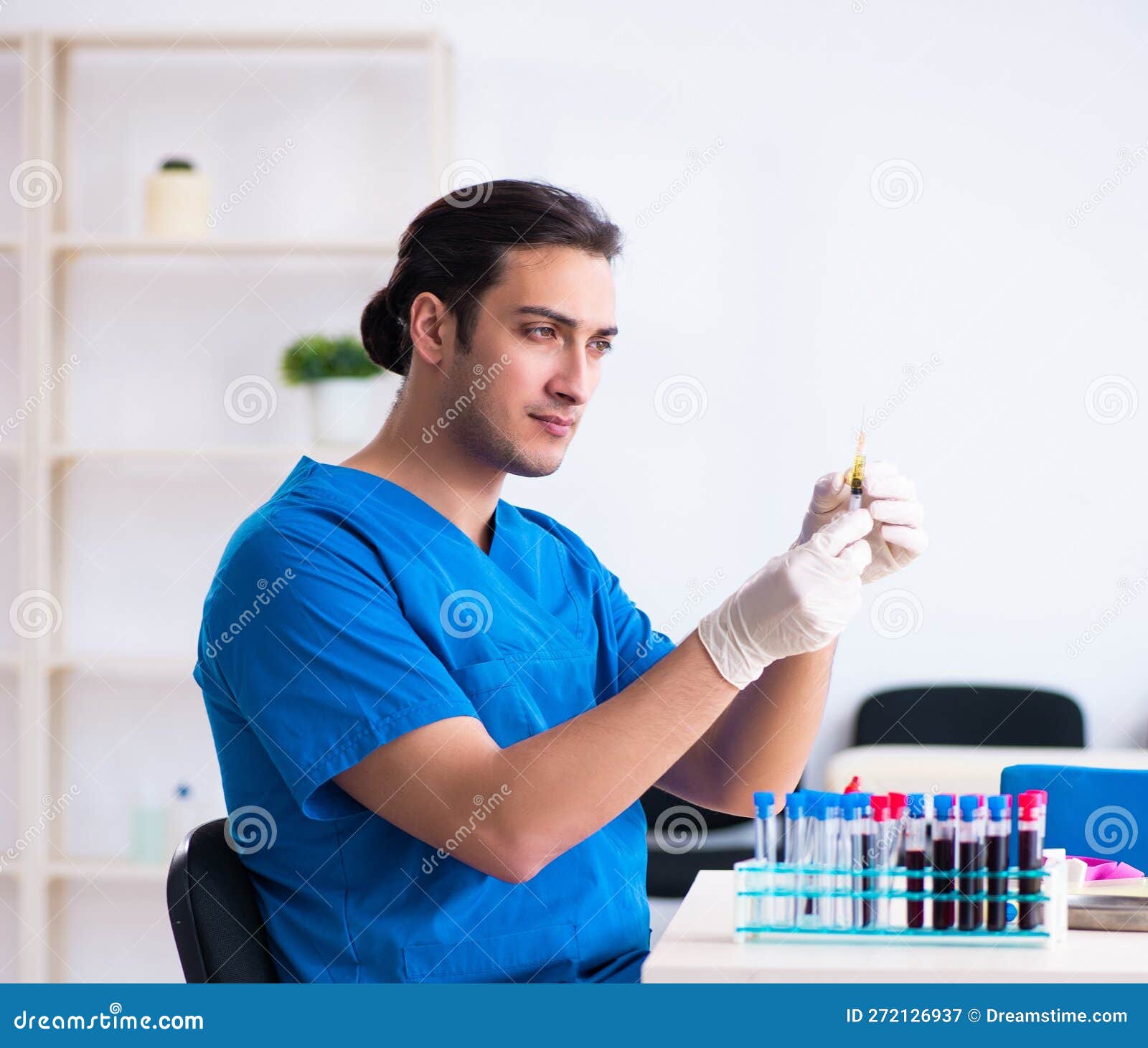 Young Lab Assistant Testing Blood Samples in Hospital Stock Image ...