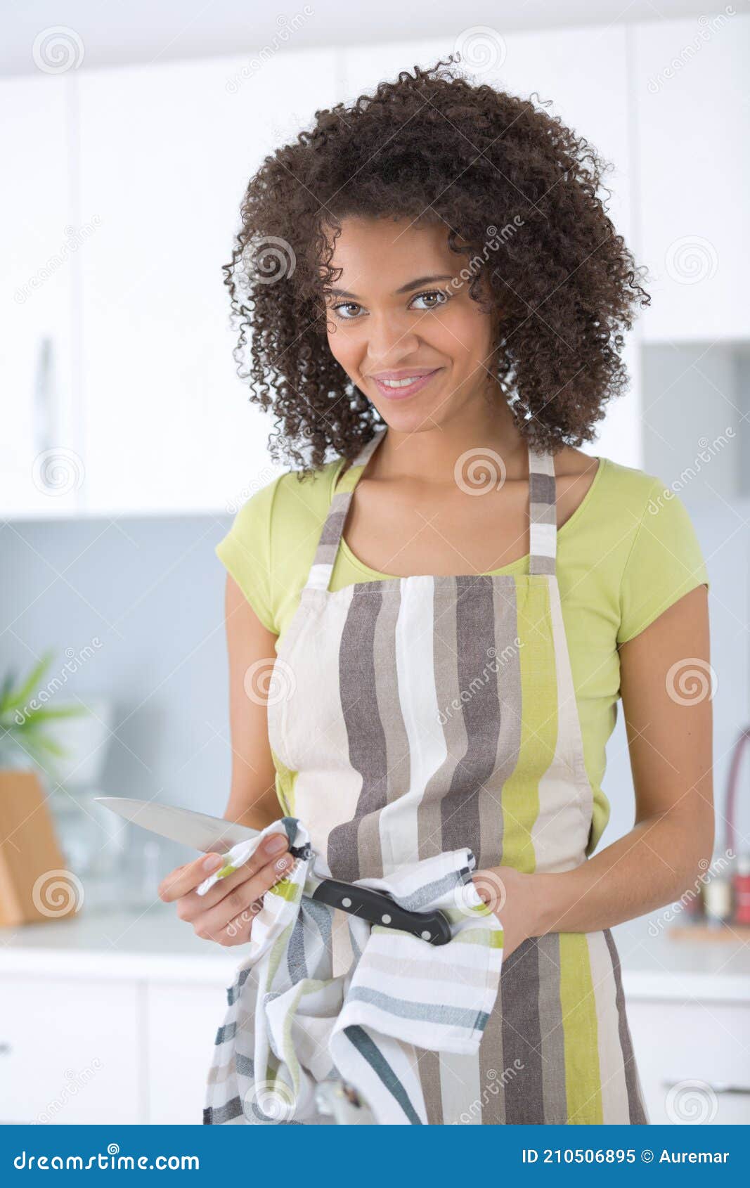 Young lady drying knife stock image. Image of ethnicity - 210506895