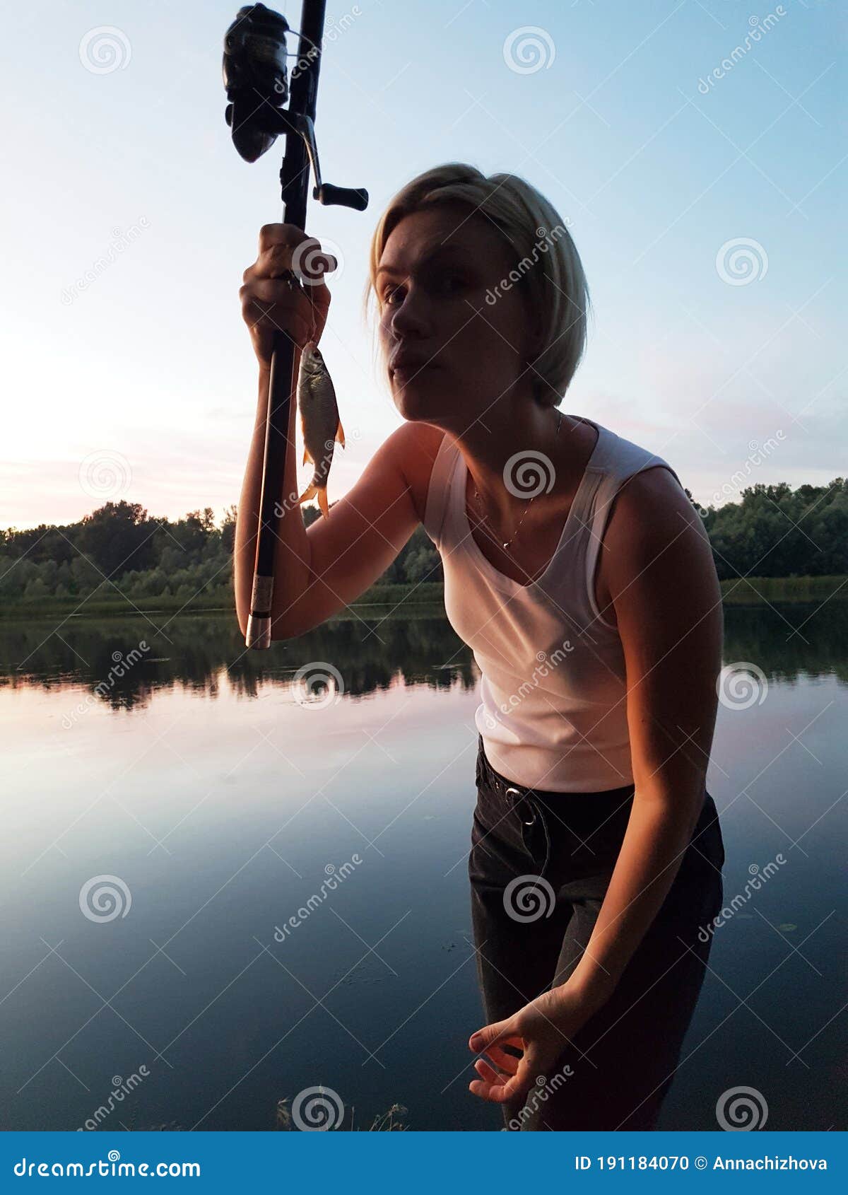 Young Lady Fishing on the River at Sunset Stock Photo - Image of catch ...