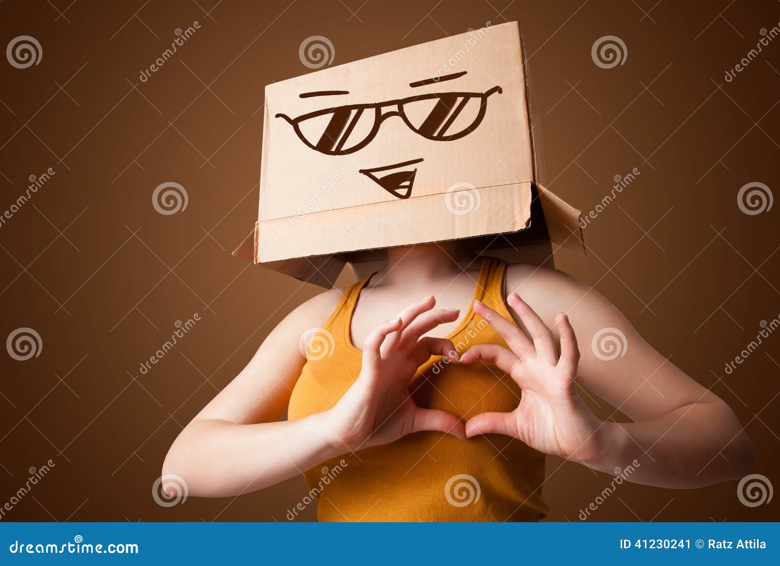 Young Lady Gesturing with a Cardboard Box on Her Head with Smile Stock ...