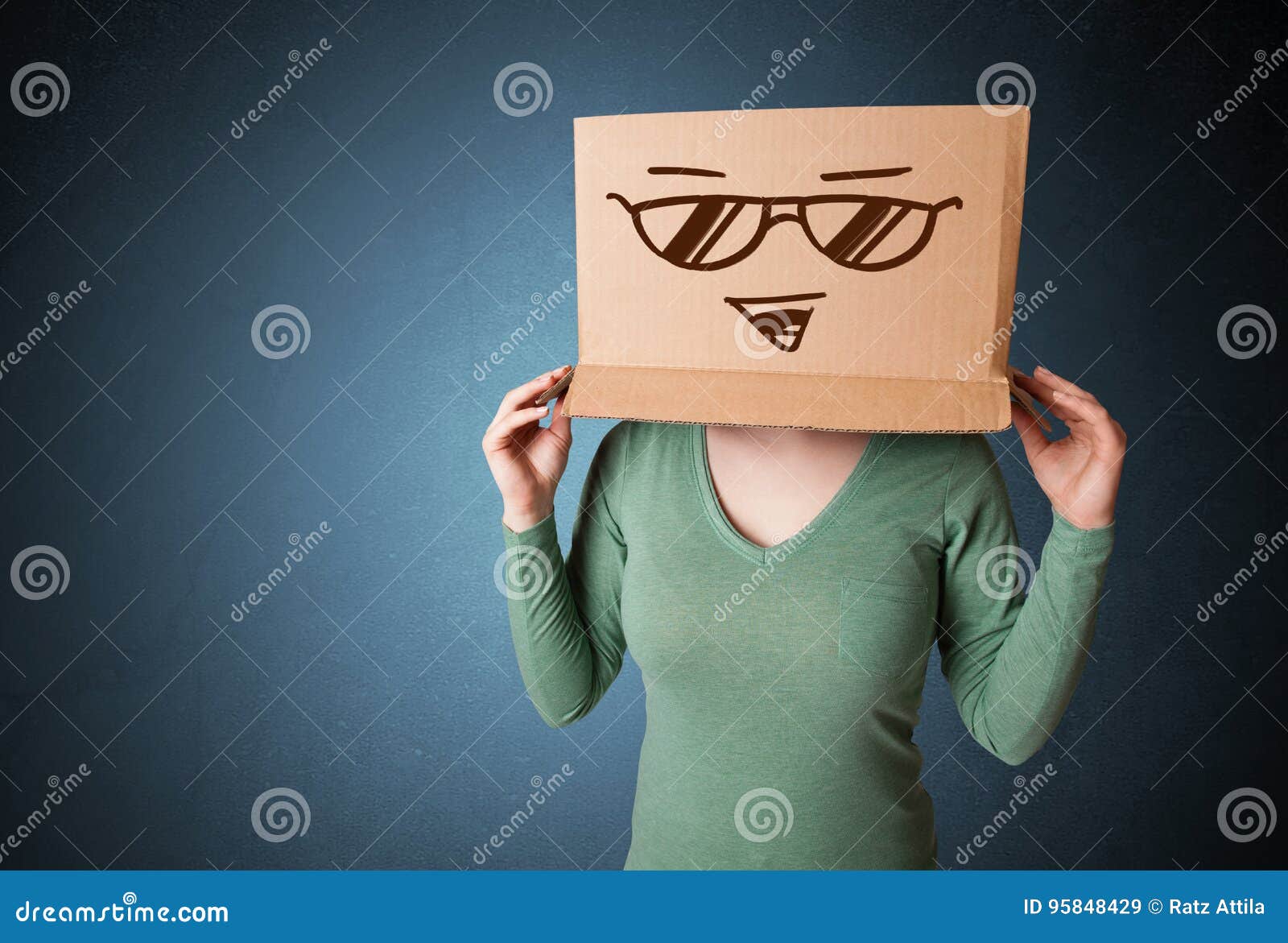 Young Lady Gesturing with a Cardboard Box on Her Head with Smile Stock ...