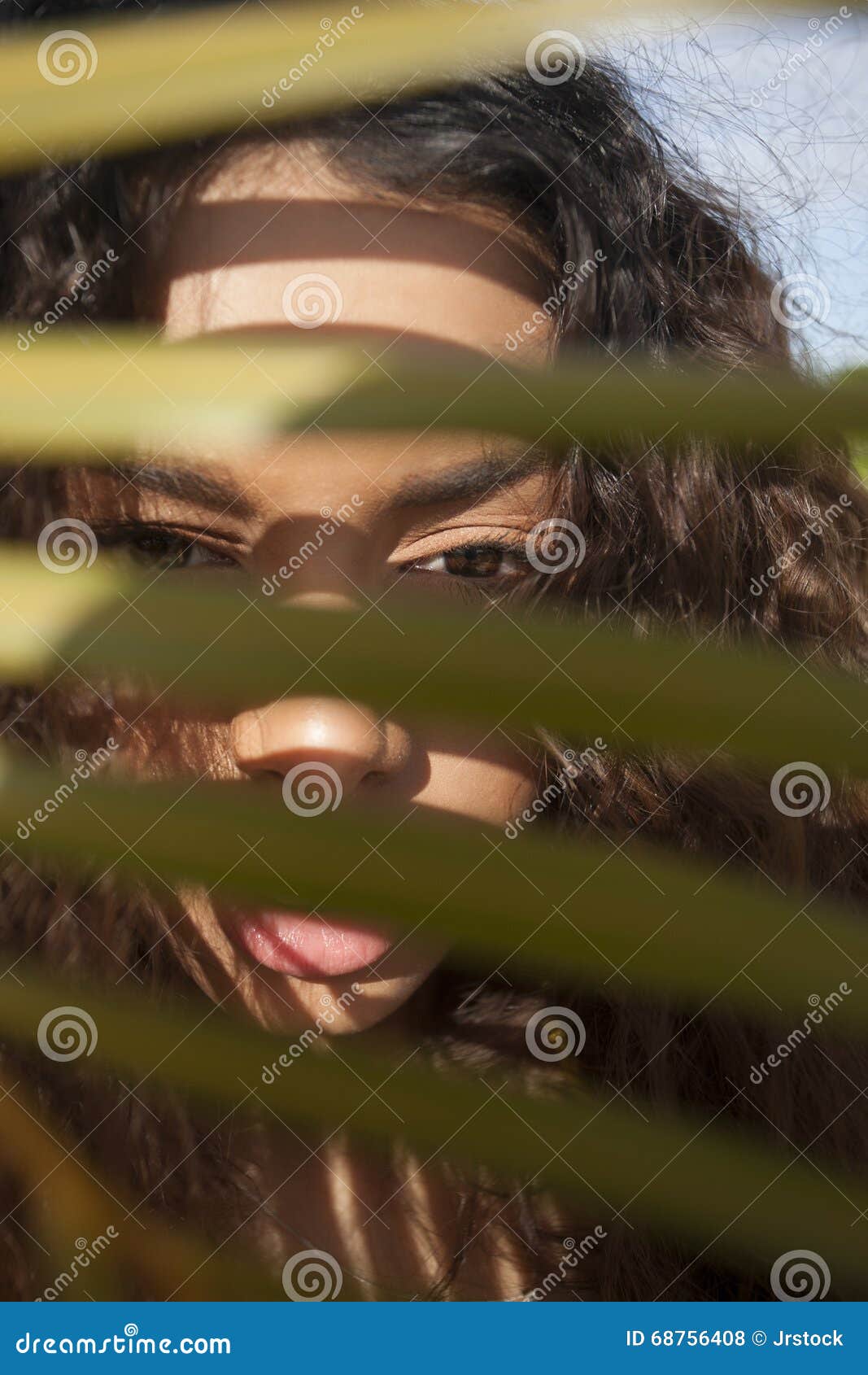 Young Lady Hiding in Shock Behind Leaves Stock Photo - Image of forest ...