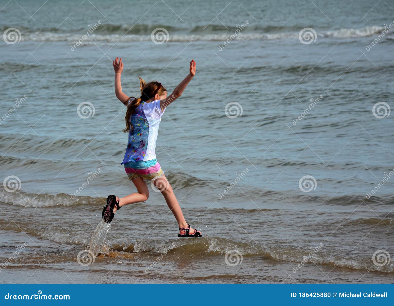 Young Lady Jumping into Waves Stock Photo - Image of teen, waves: 186425880